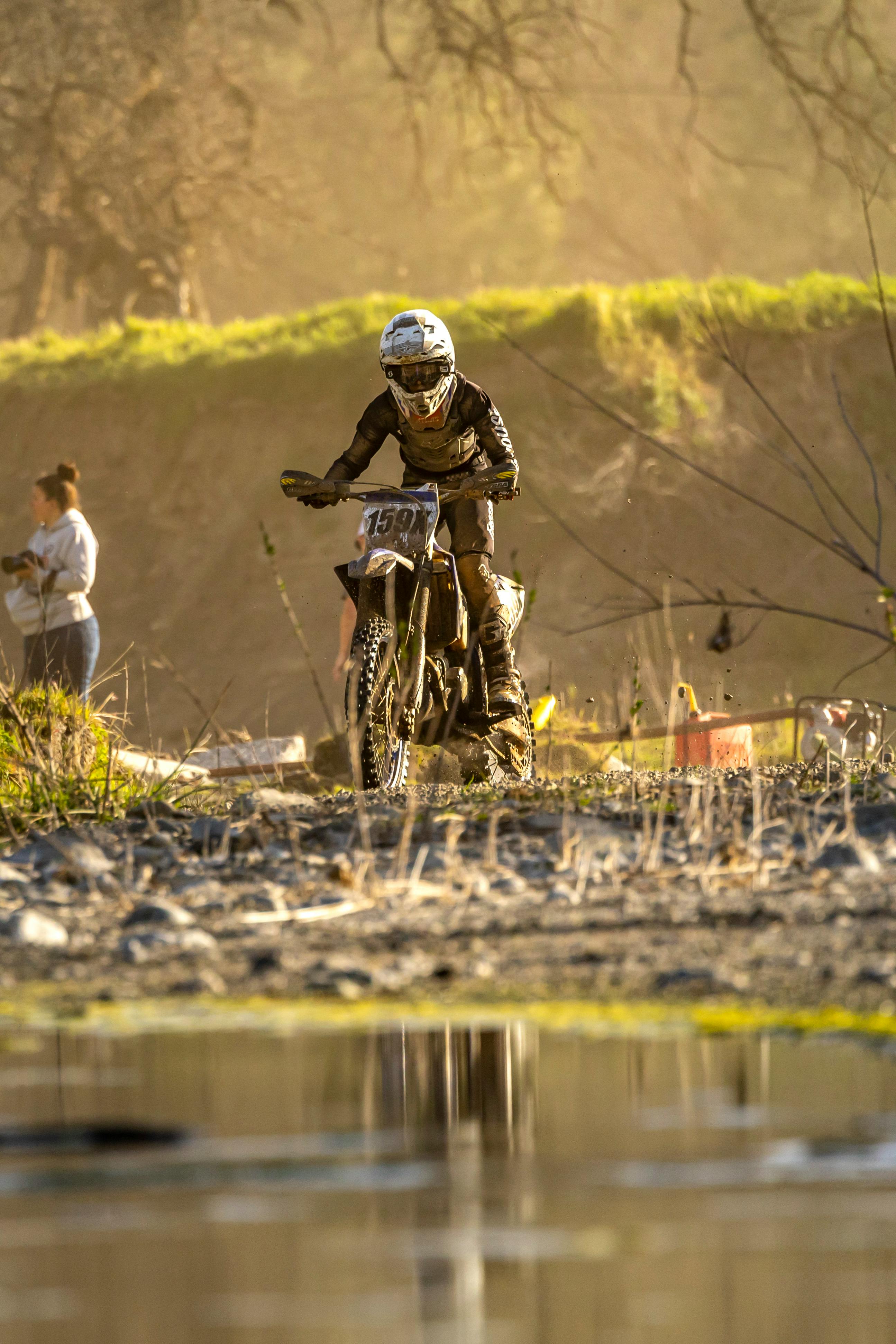 Motocross Rider Traversing Muddy Terrain · Free Stock Photo