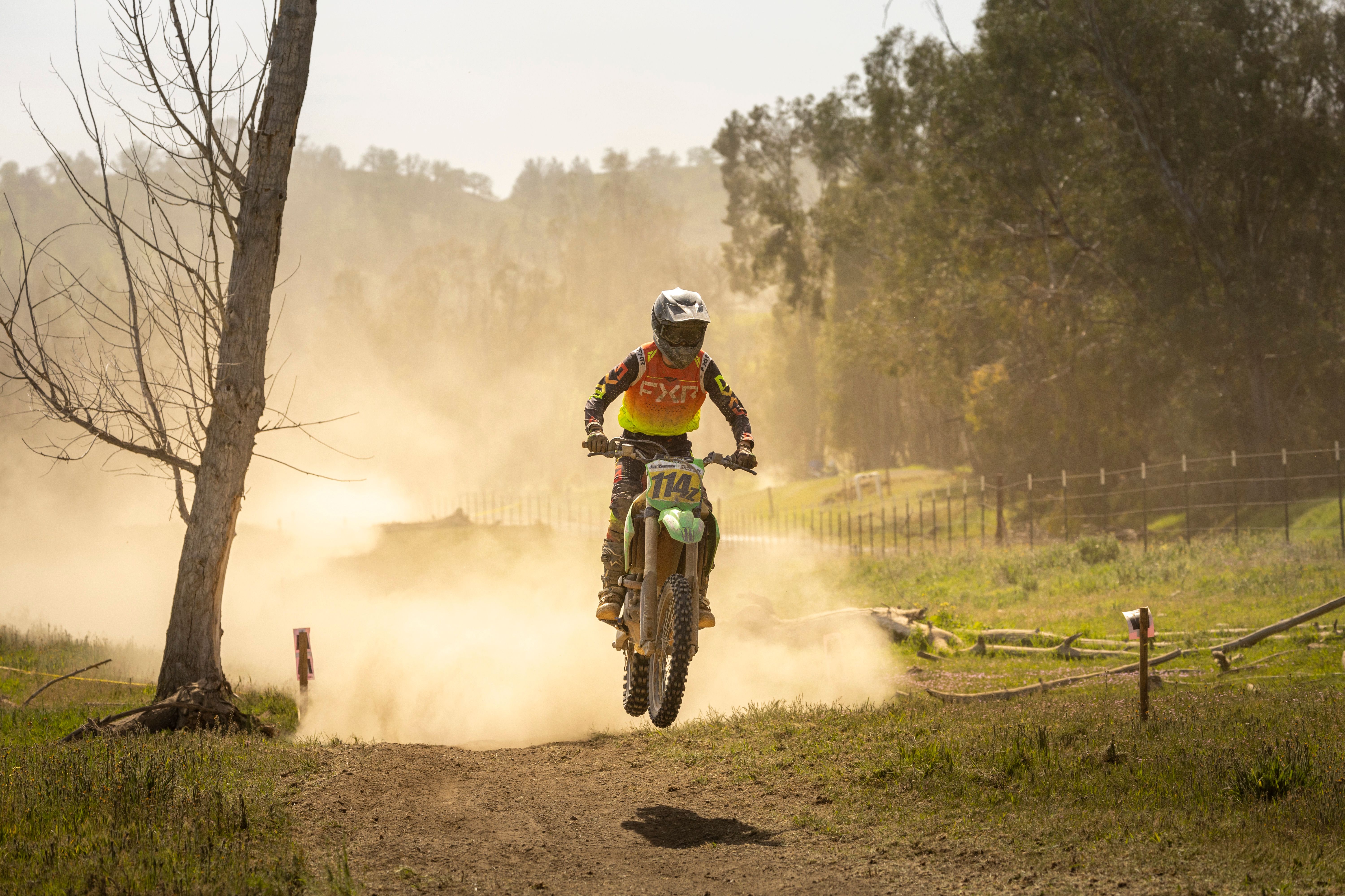 Motocross Rider in Action on Dusty Track · Free Stock Photo