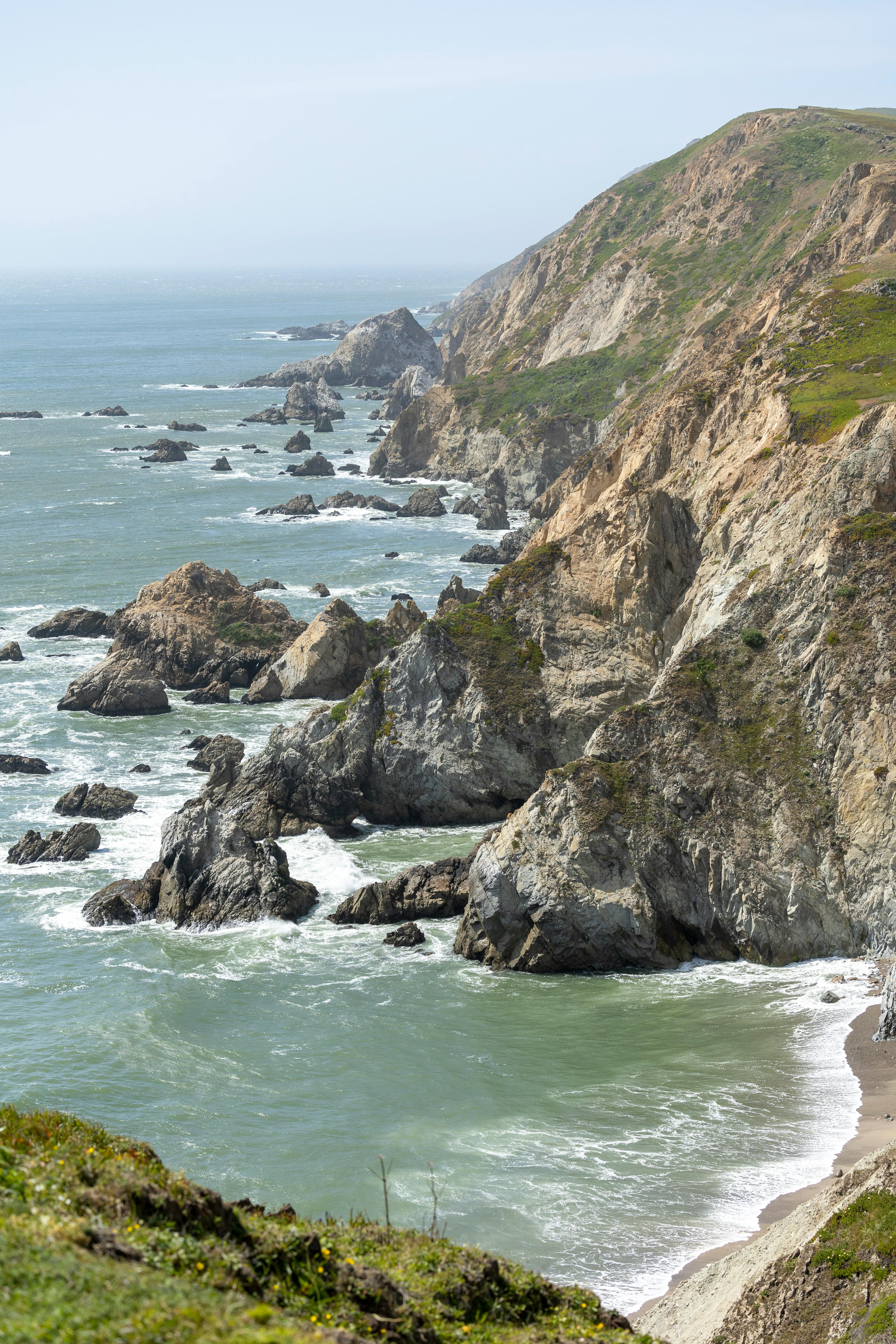 Rocky Coastal Cliffs Overlooking Ocean Waves · Free Stock Photo