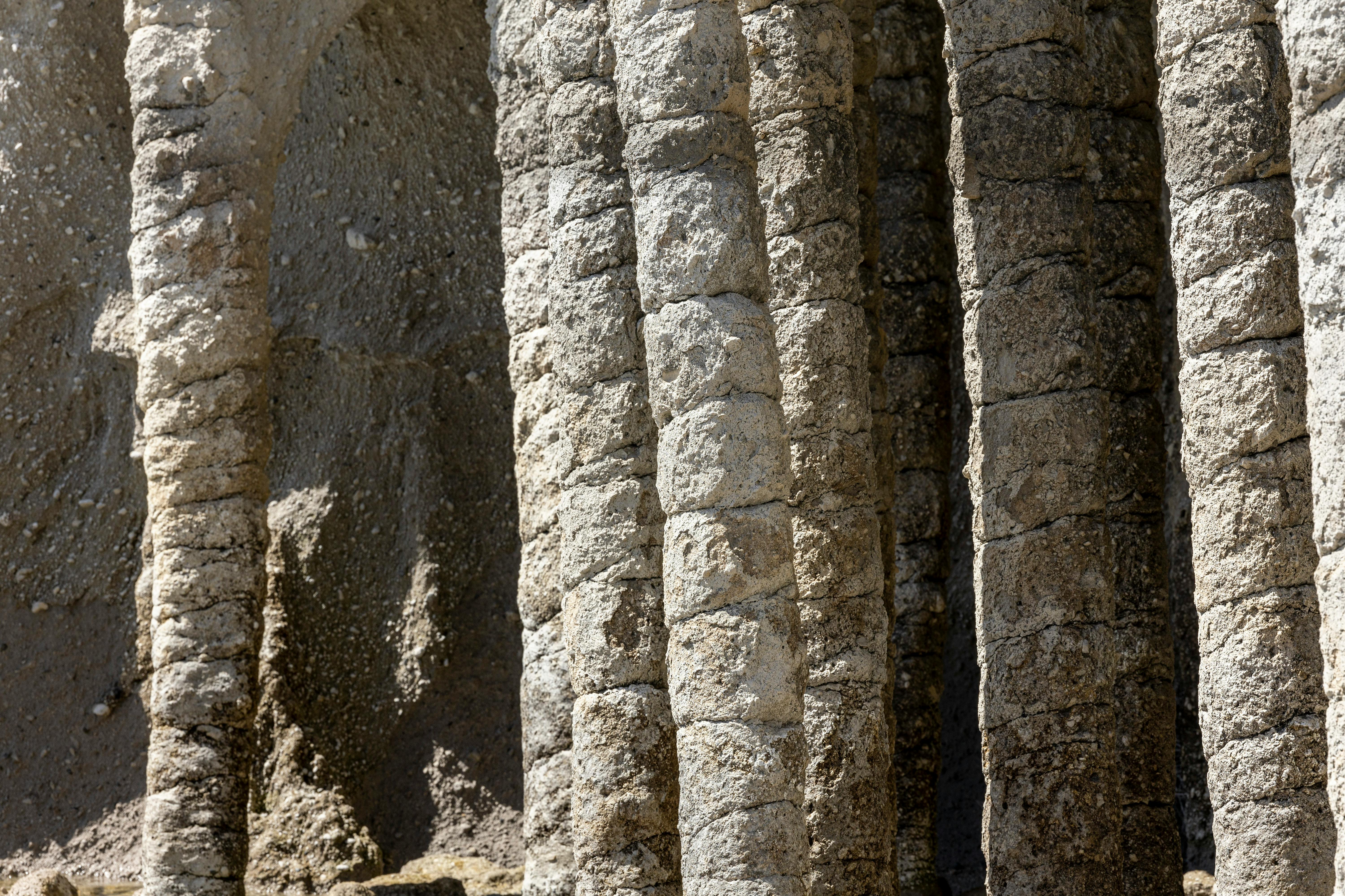 Textured Stone Pillars in Bright Sunlight · Free Stock Photo