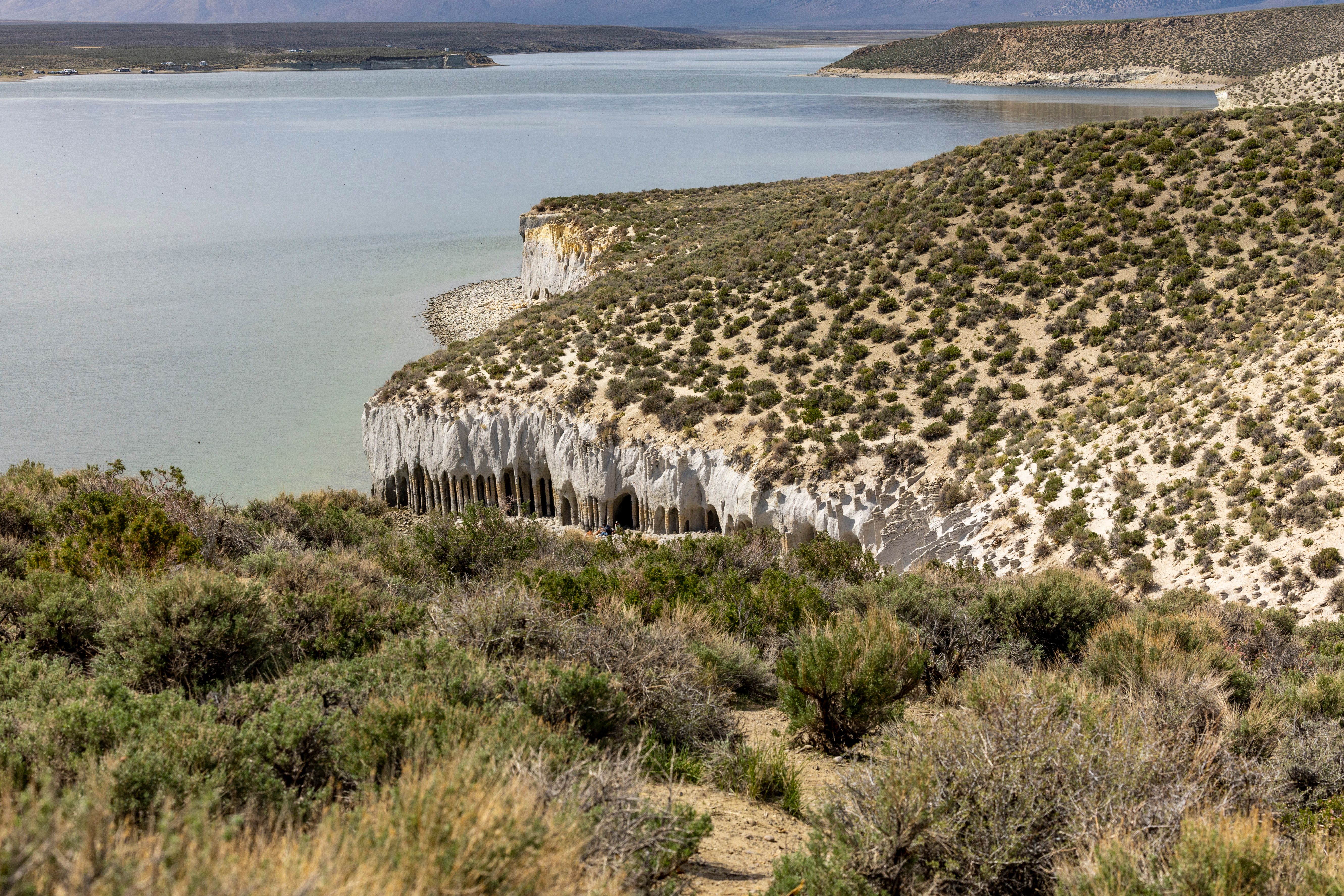 Stunning Coastal Cliff by Tranquil Lake · Free Stock Photo