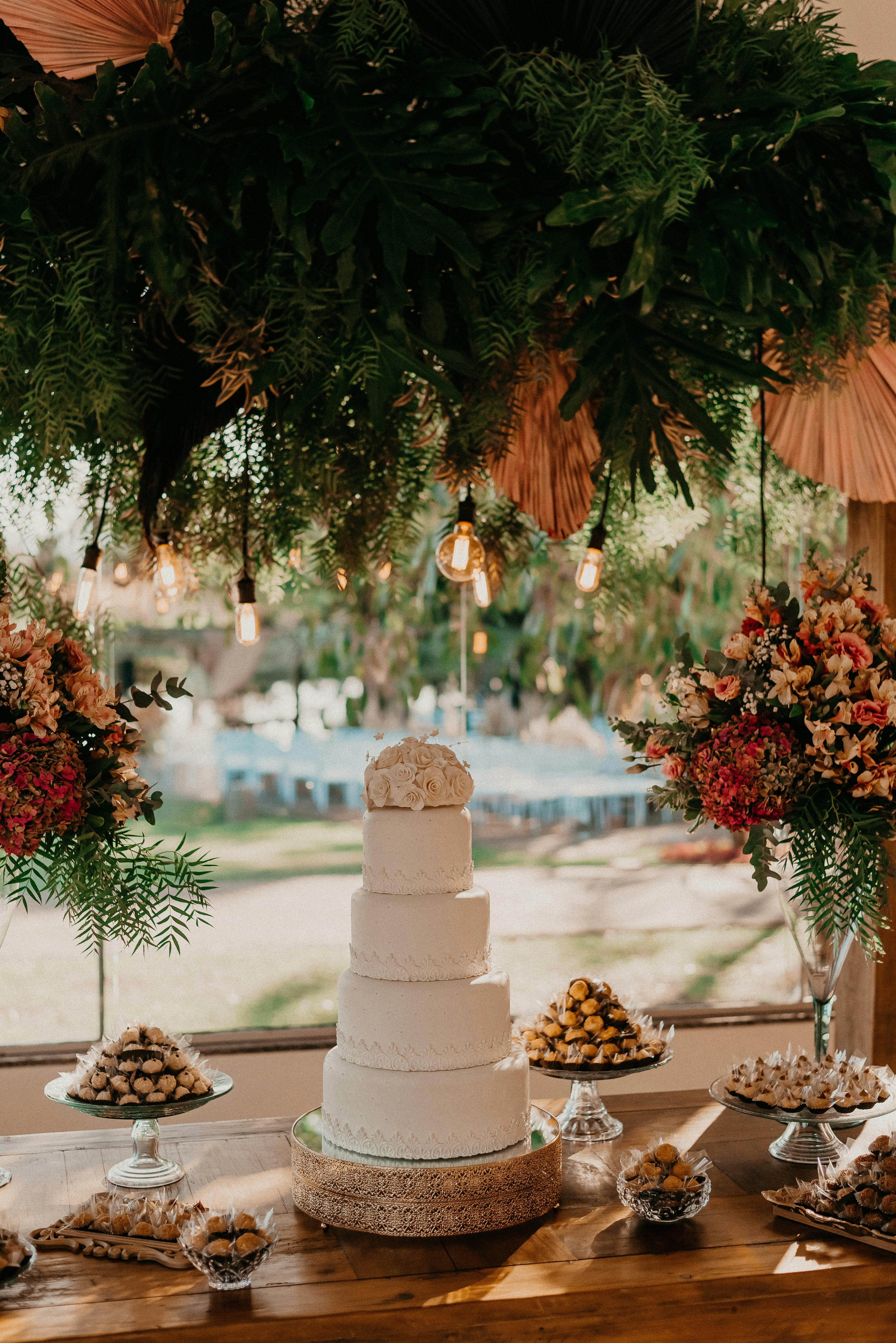 Elegant Wedding Cake Display with Floral Decor · Free Stock Photo