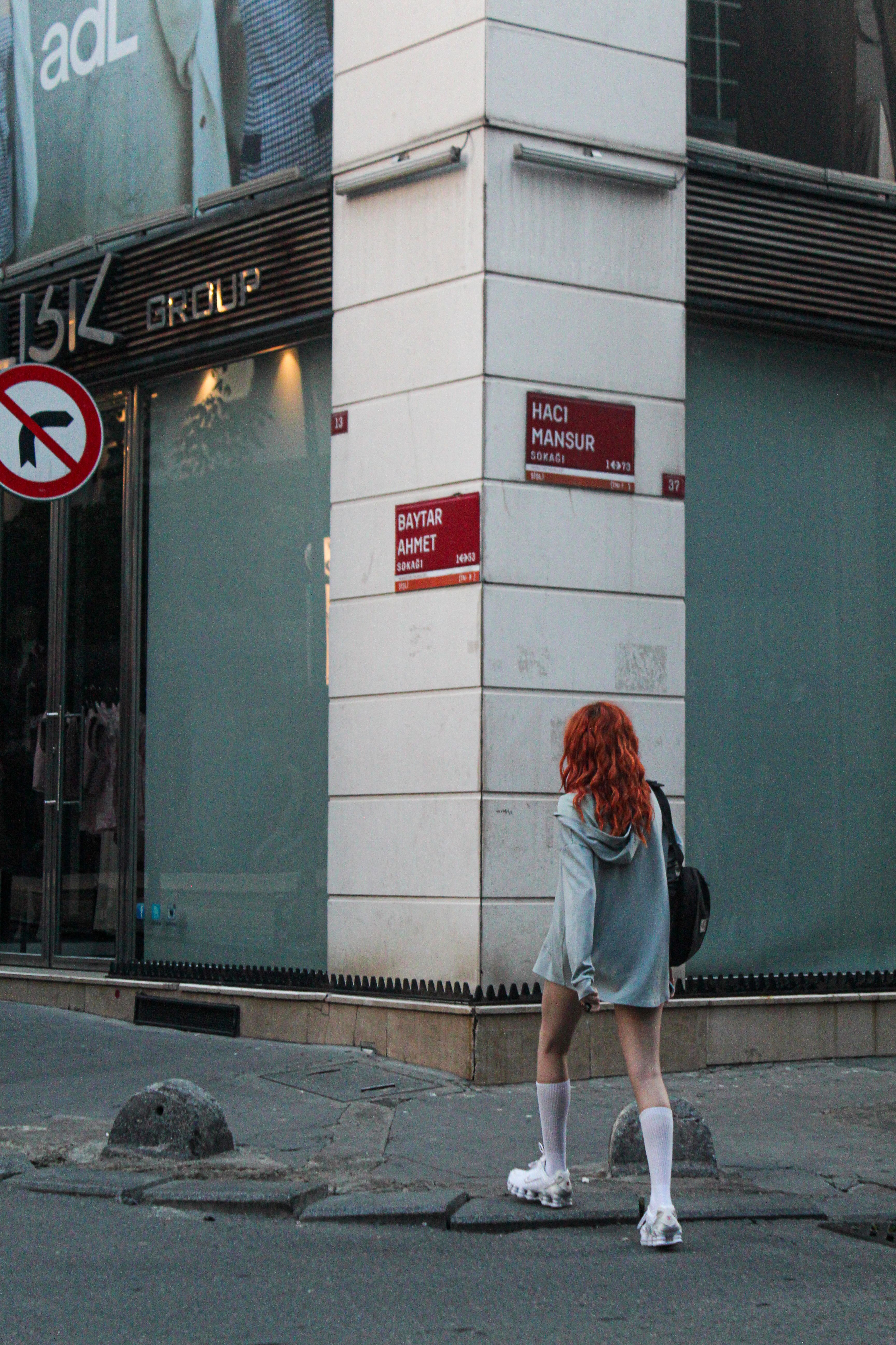 Urban Street Scene with Person and Storefront · Free Stock Photo