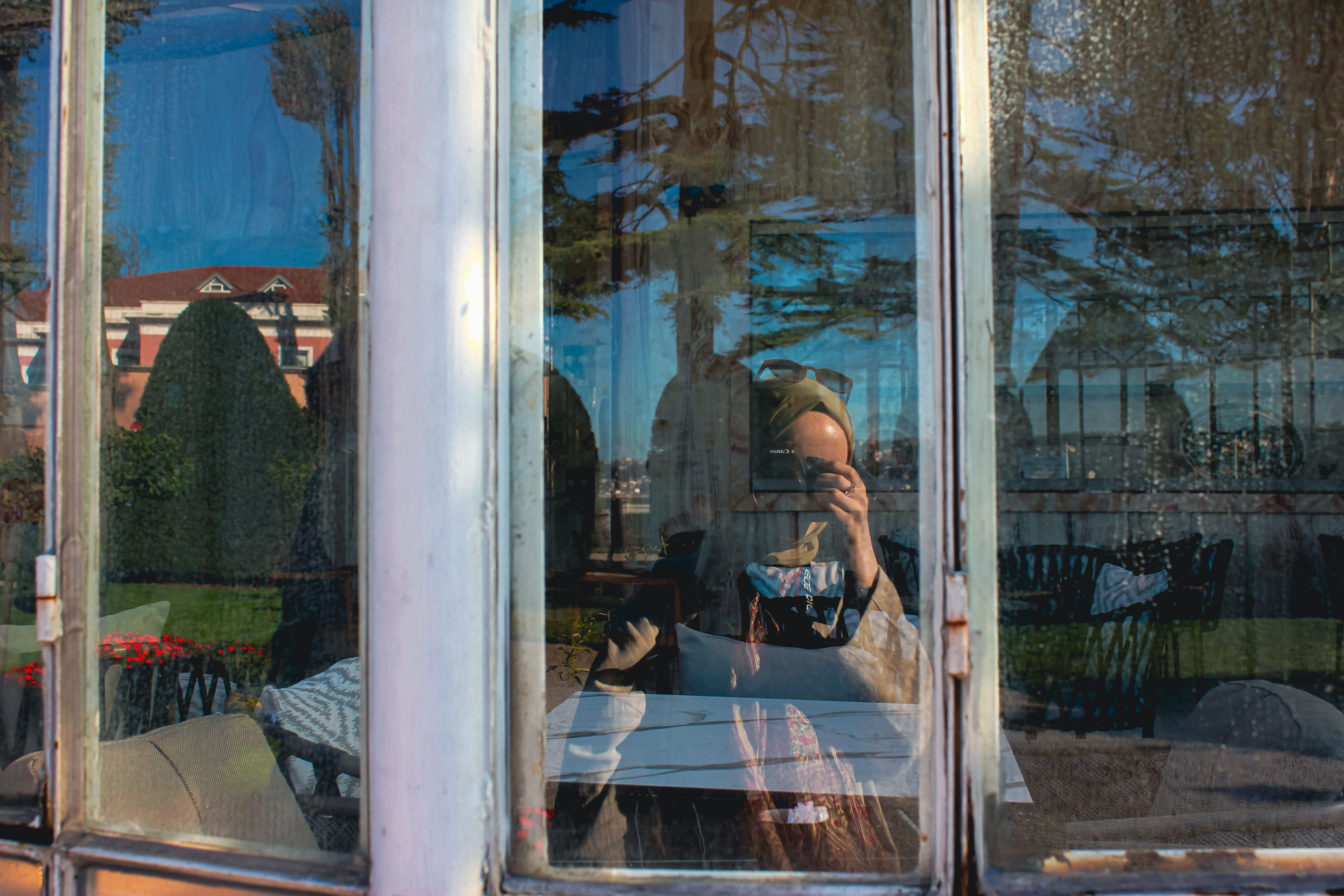 Reflective Window Photography with Unique Perspective · Free Stock Photo