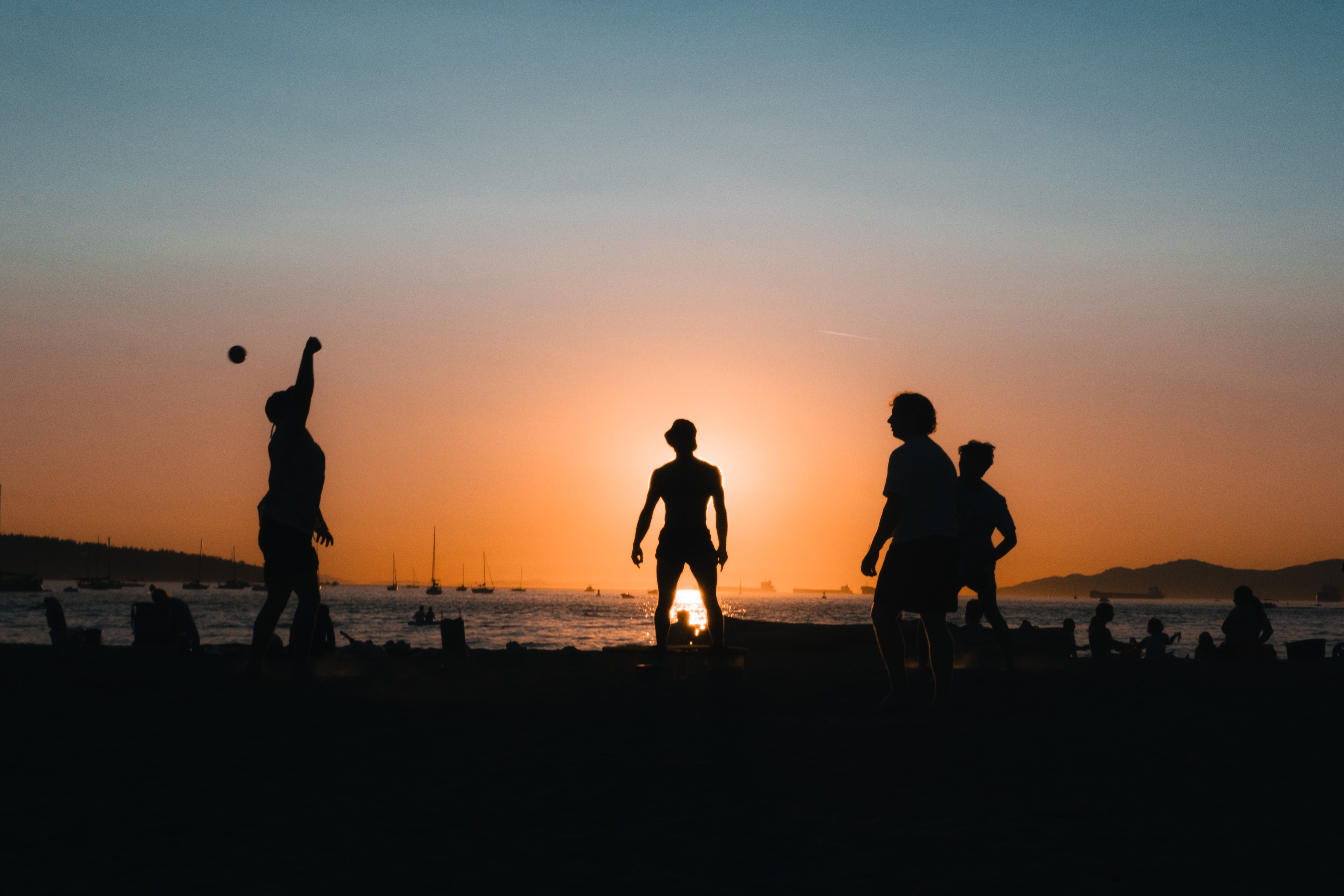 Silhouetted Beach Games at Vancouver Sunset · Free Stock Photo