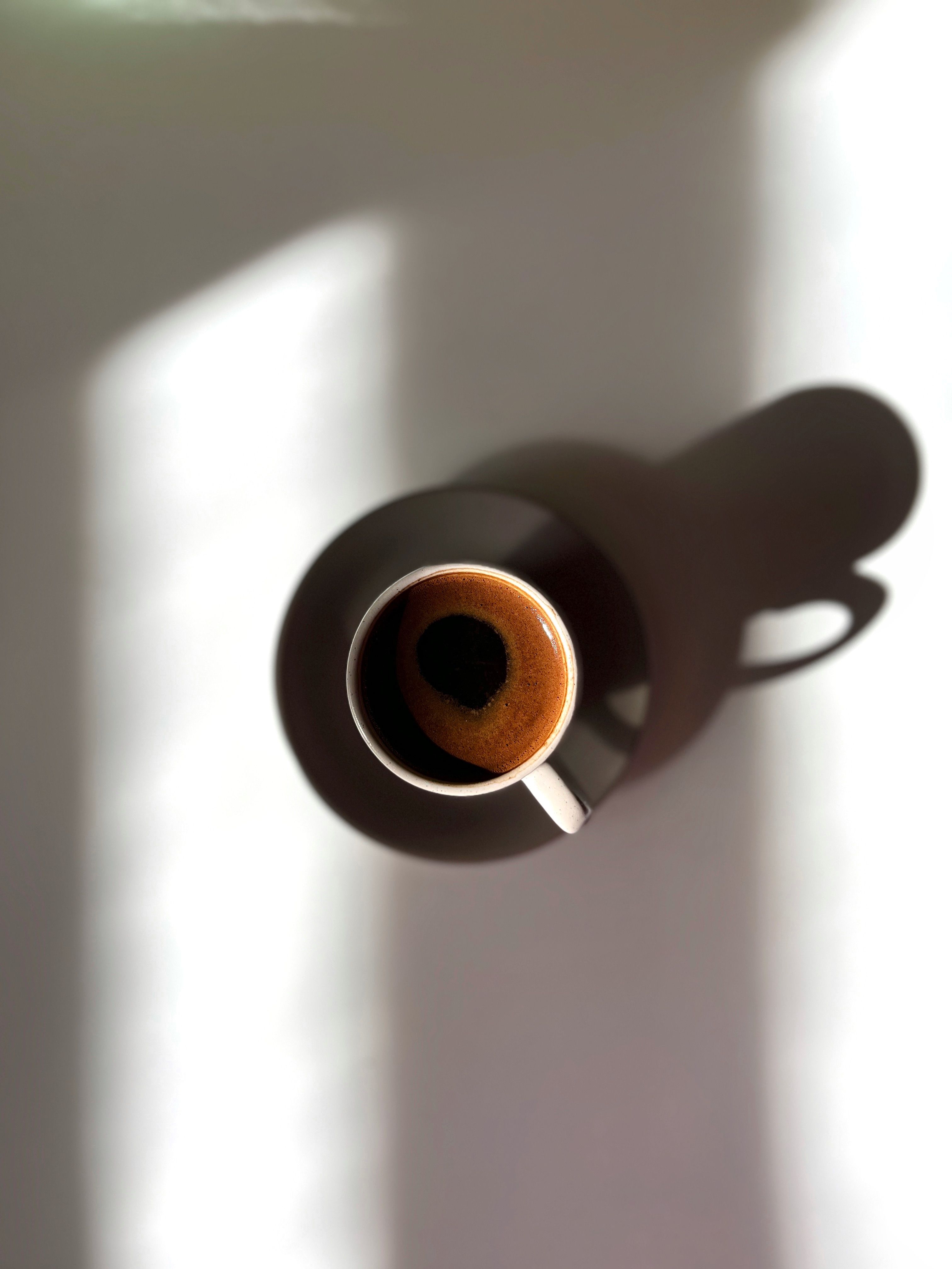 Minimalist Overhead Shot of Espresso Cup · Free Stock Photo
