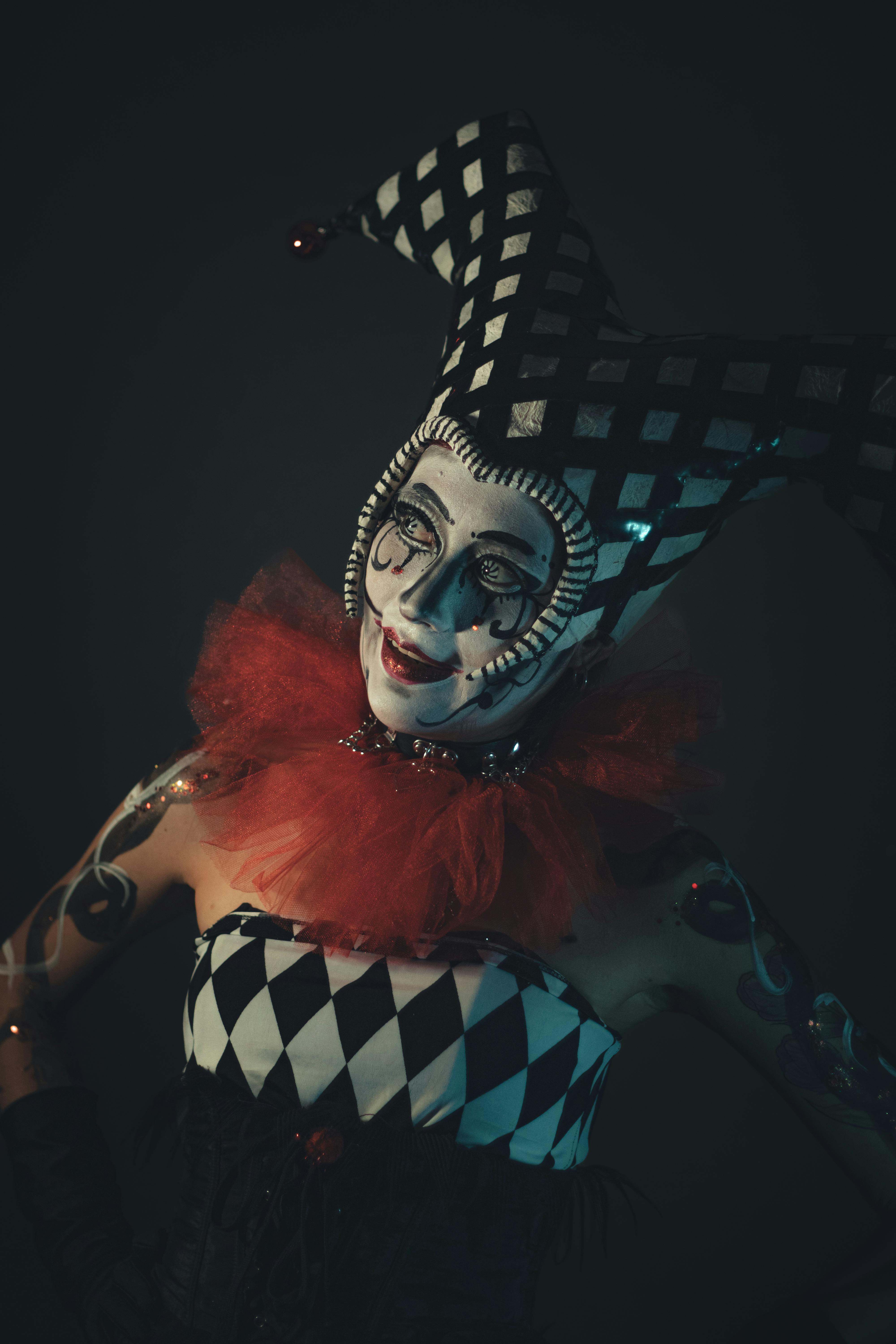 Mysterious Jester Woman in Dramatic Costume · Free Stock Photo