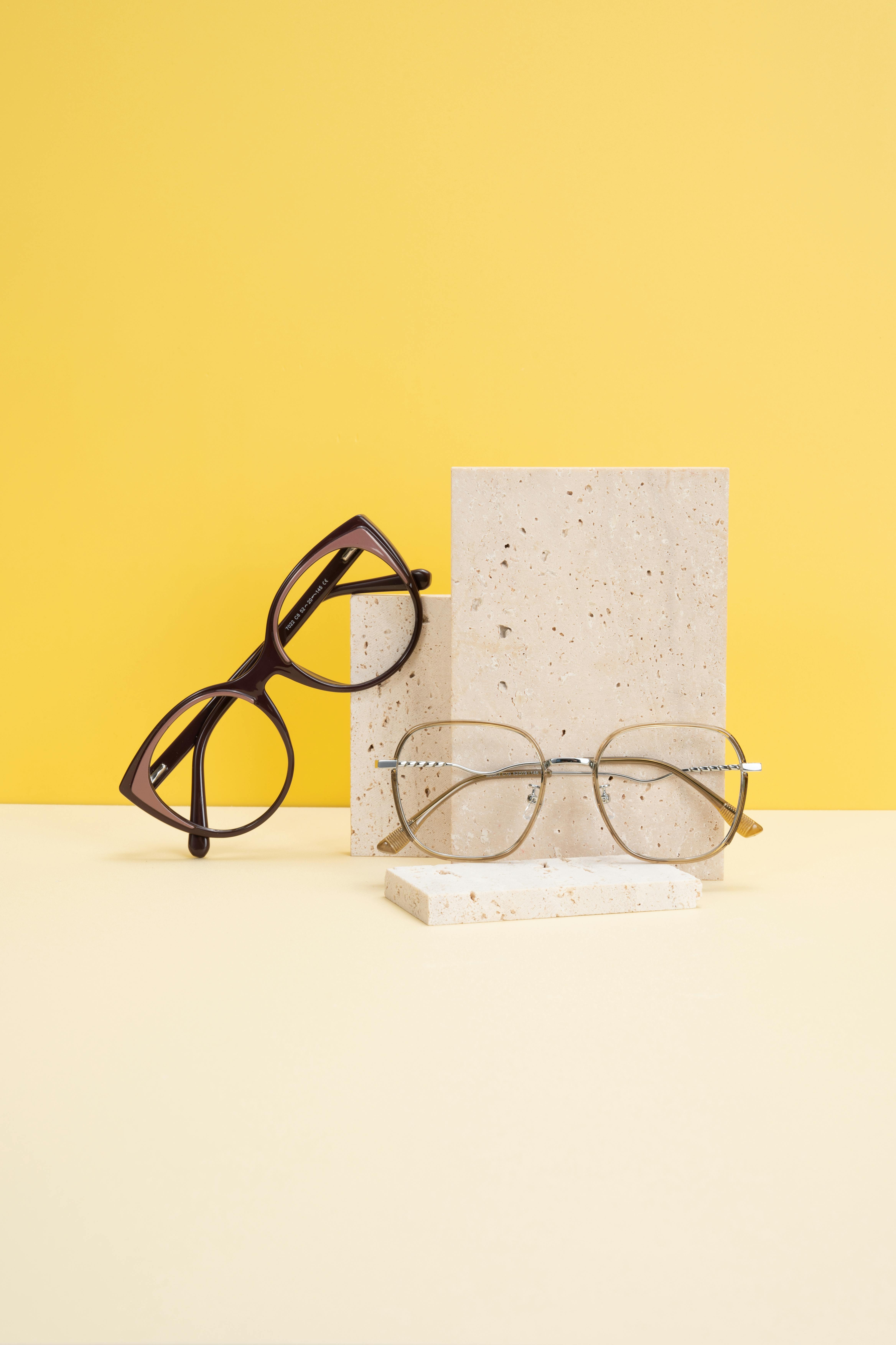 Stylish Eyeglass Frames on Yellow Background · Free Stock Photo