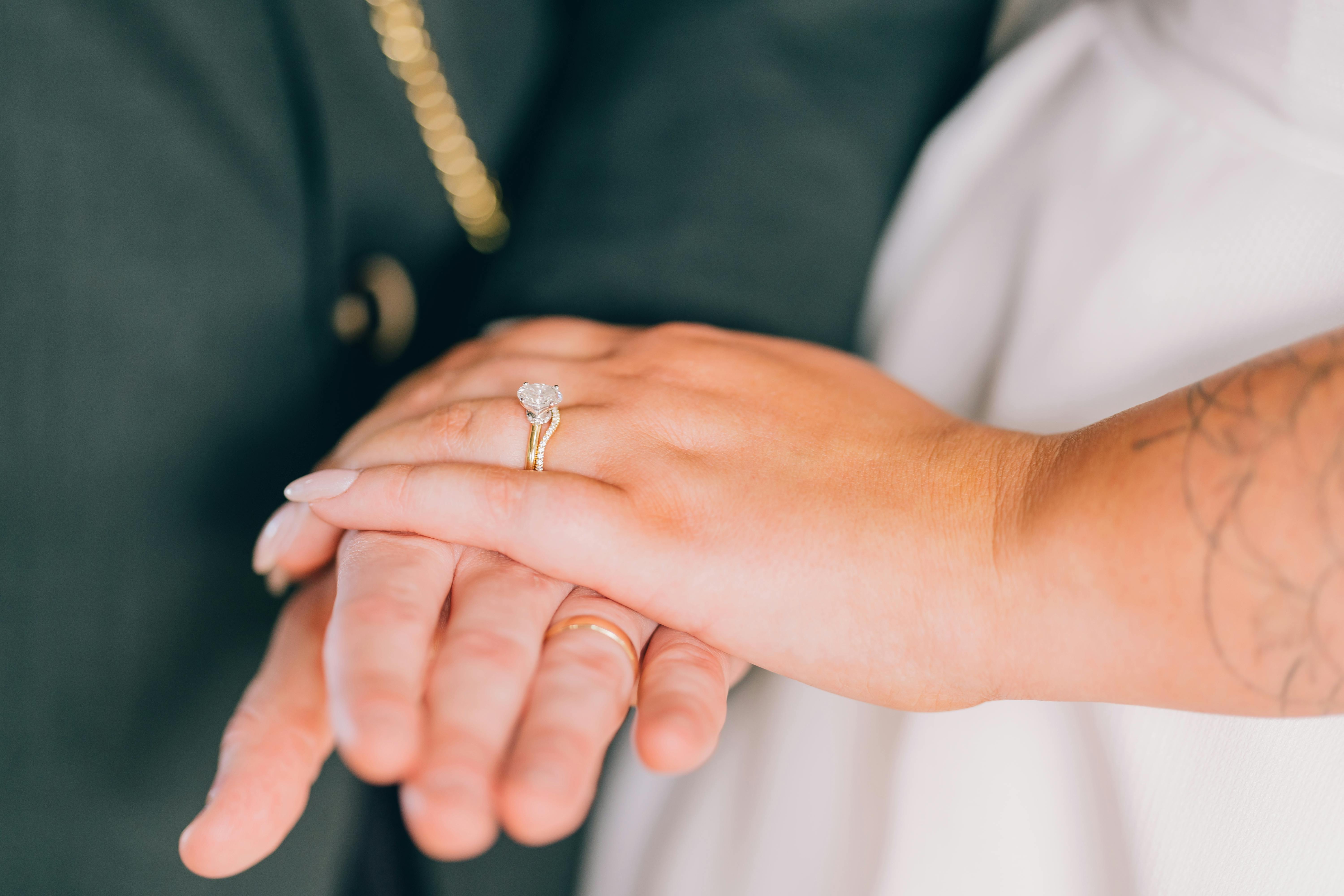 Close-up of Hands with Diamond Wedding Ring · Free Stock Photo