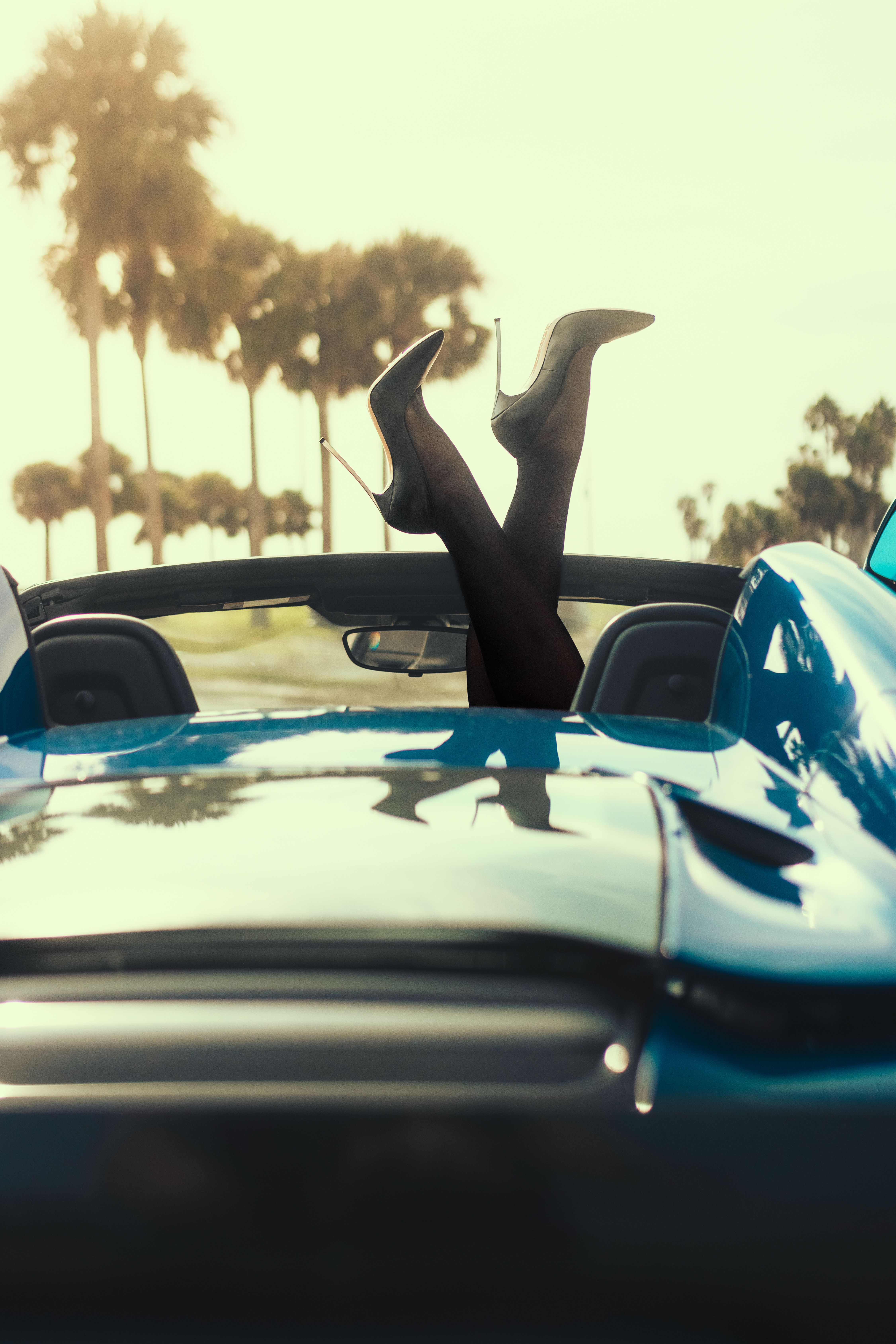 Stylish Legs in High Heels in Convertible Car · Free Stock Photo