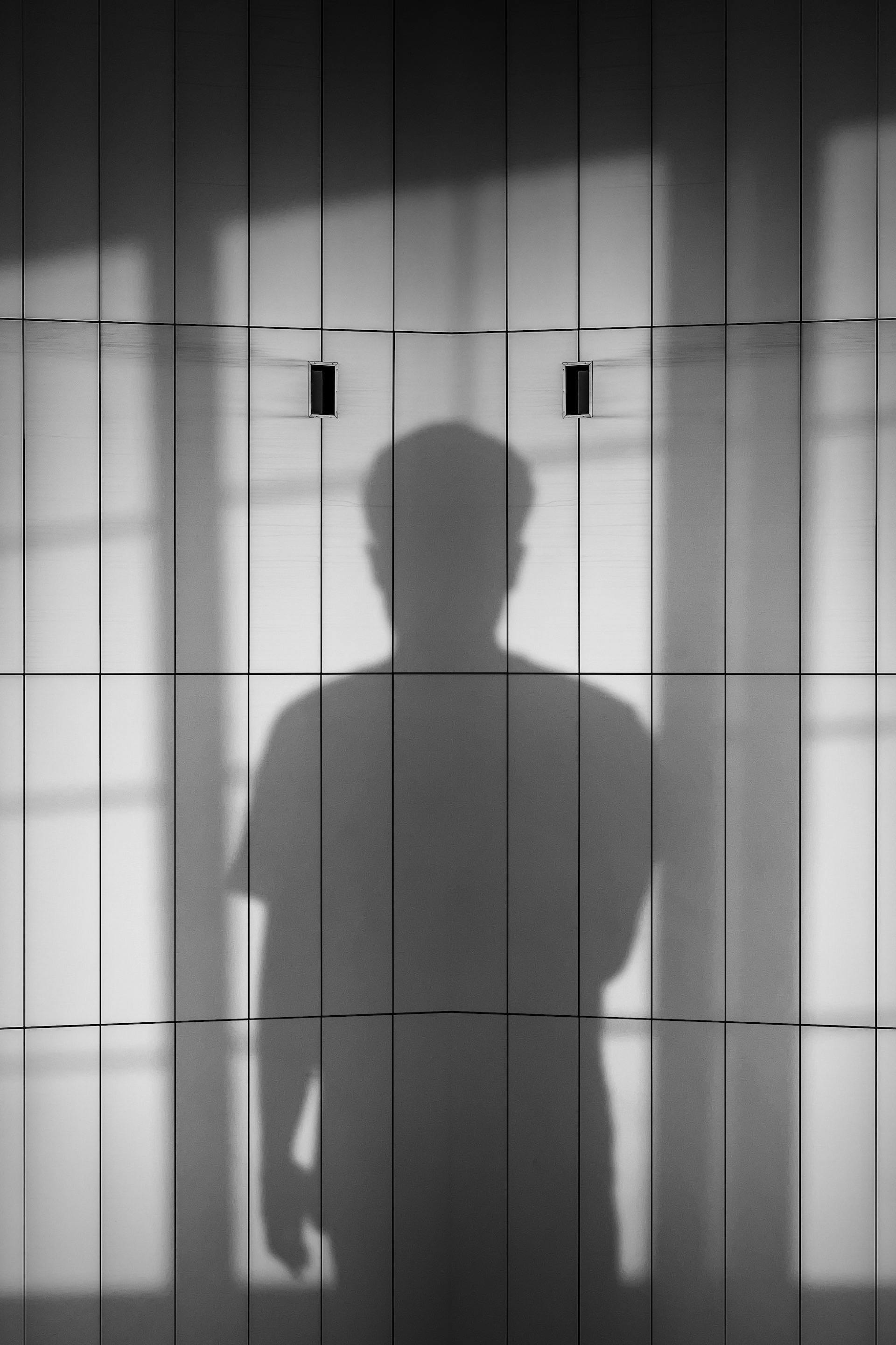 Intriguing Shadow Silhouette Cast on Wall · Free Stock Photo
