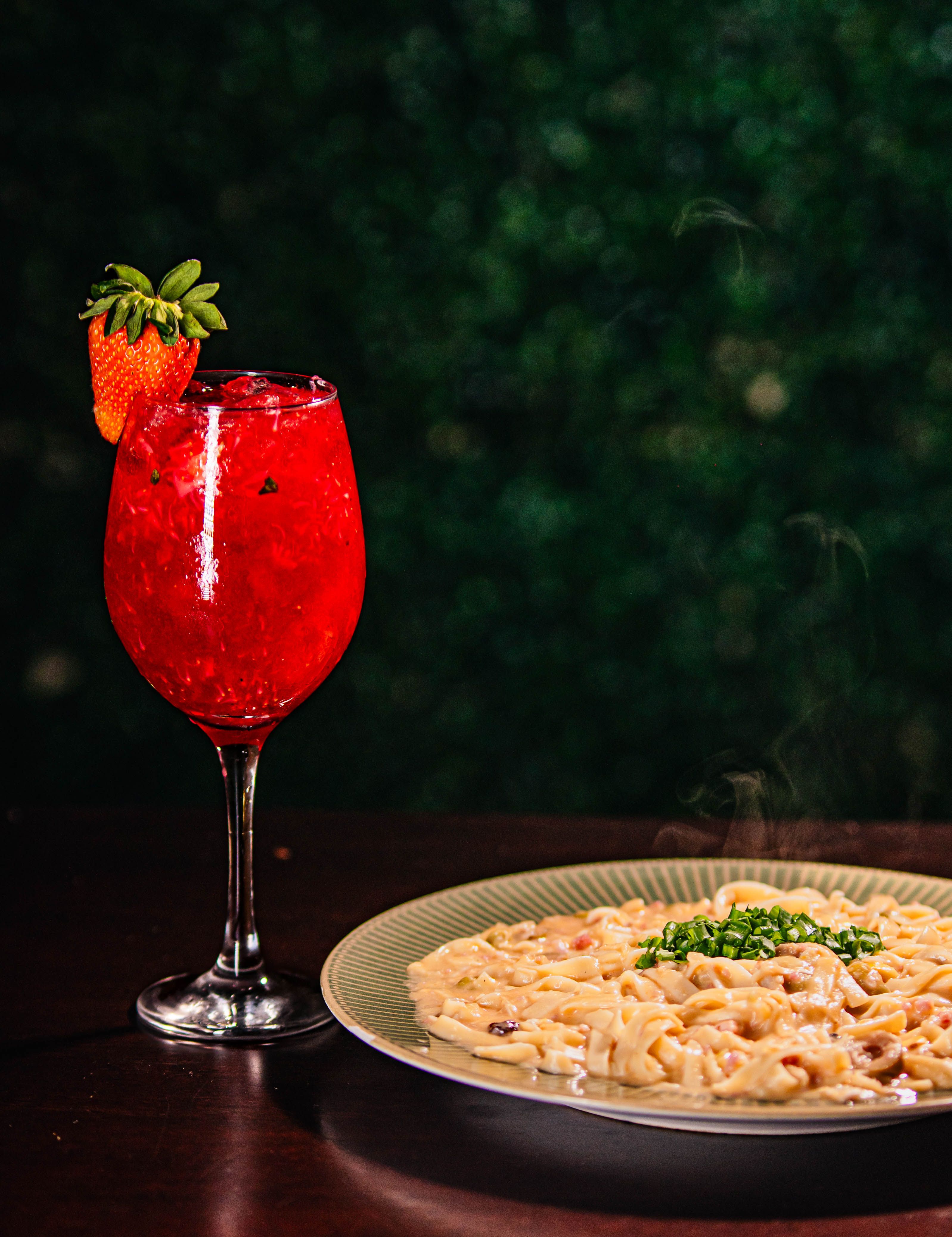 Delicious Pasta Alfredo with Refreshing Strawberry Drink · Free Stock Photo
