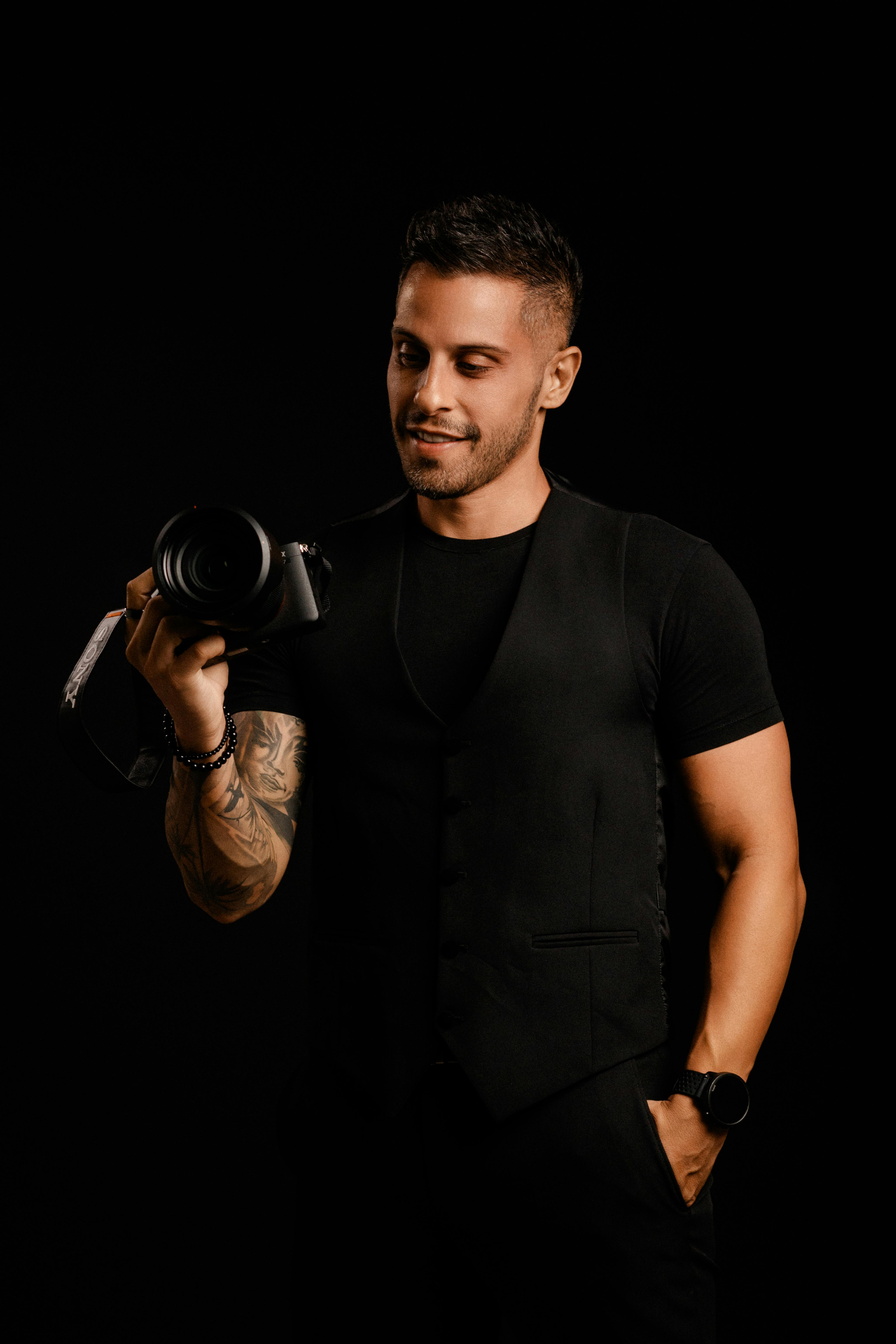 Portrait of a Confident Photographer in Black Attire · Free Stock Photo