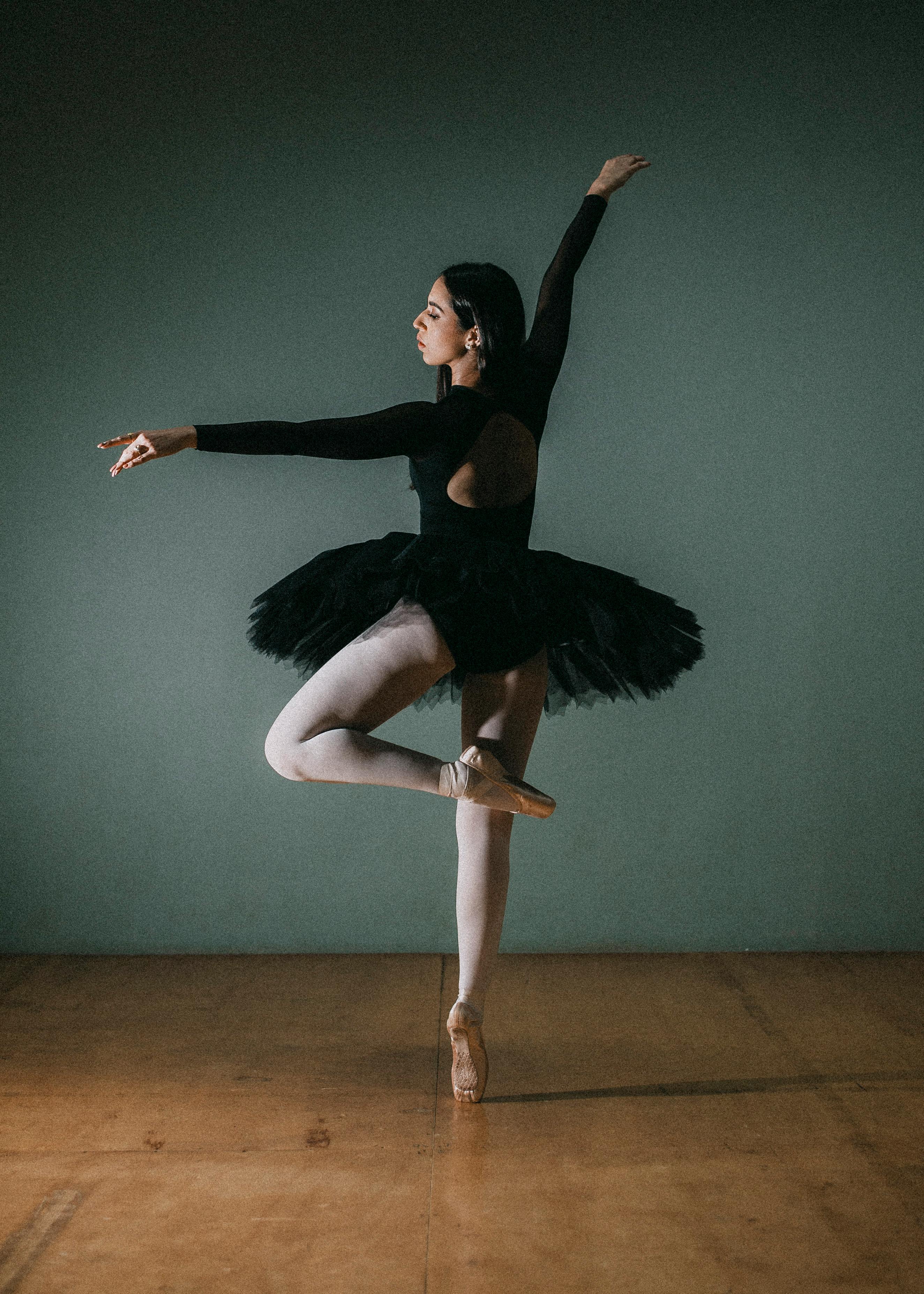 Elegant Ballet Dancer in Black Costume Performing · Free Stock Photo