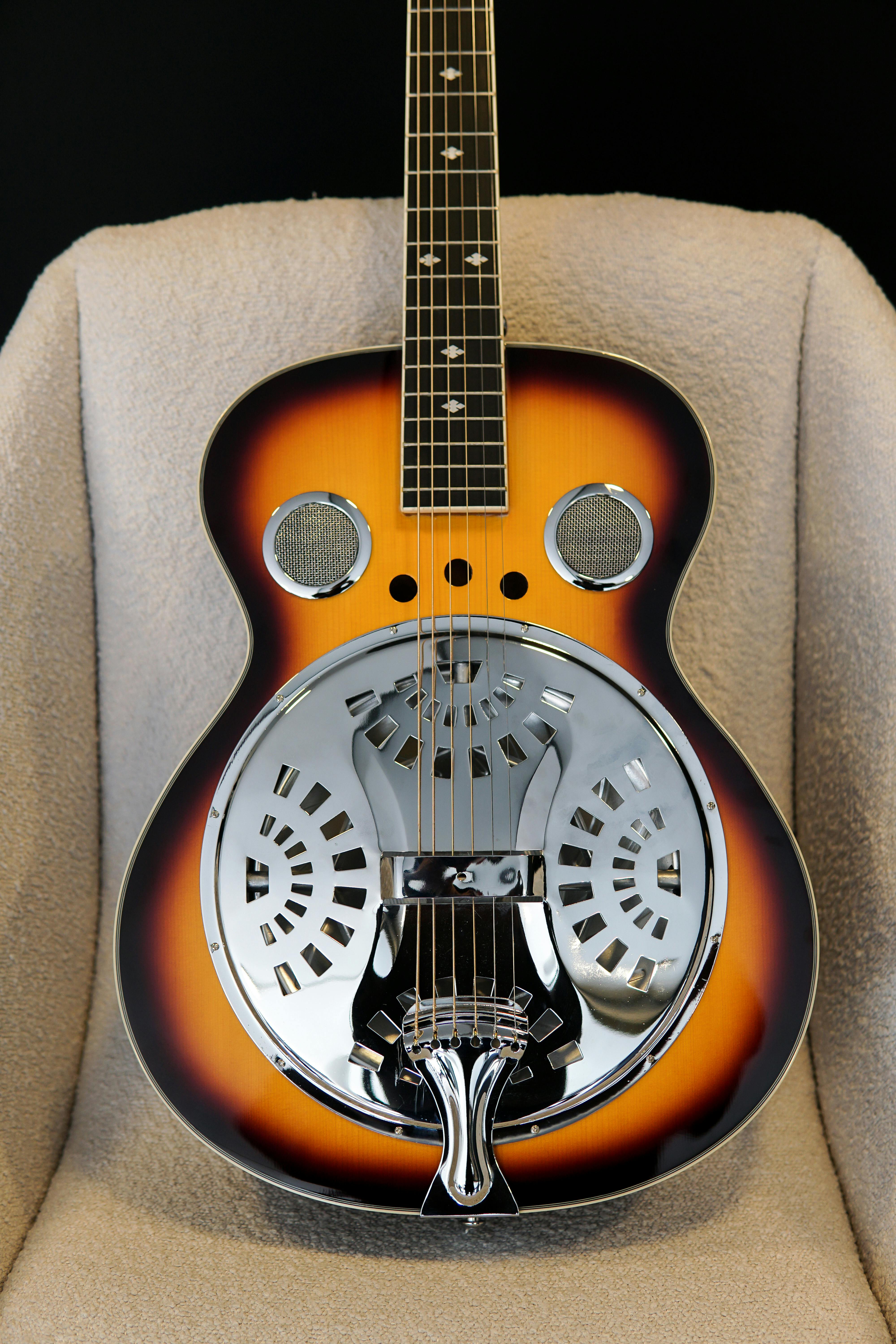 Vibrant Acoustic Resonator Guitar on Display · Free Stock Photo