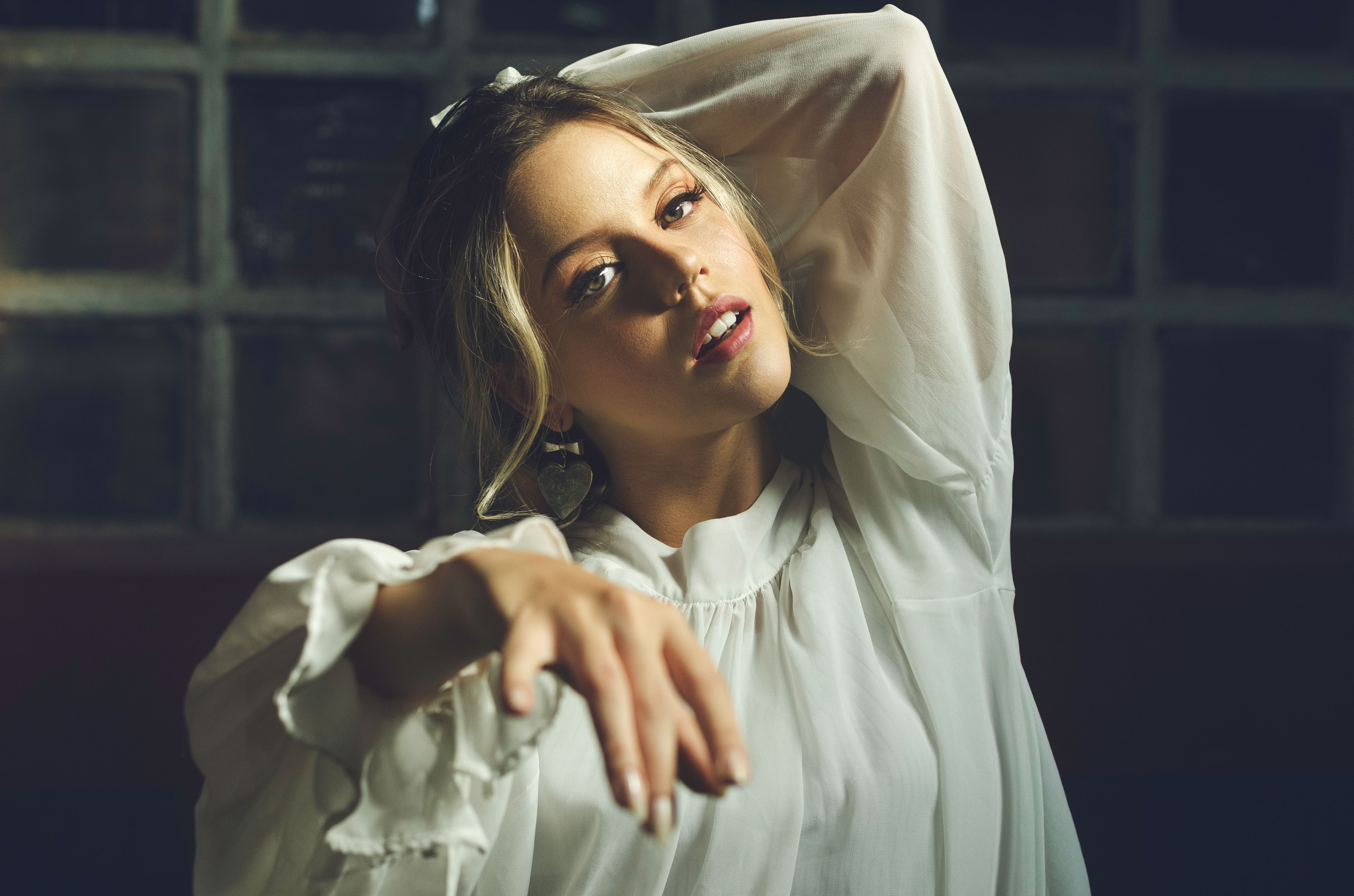 Photo Of Woman Wearing White Top · Free Stock Photo