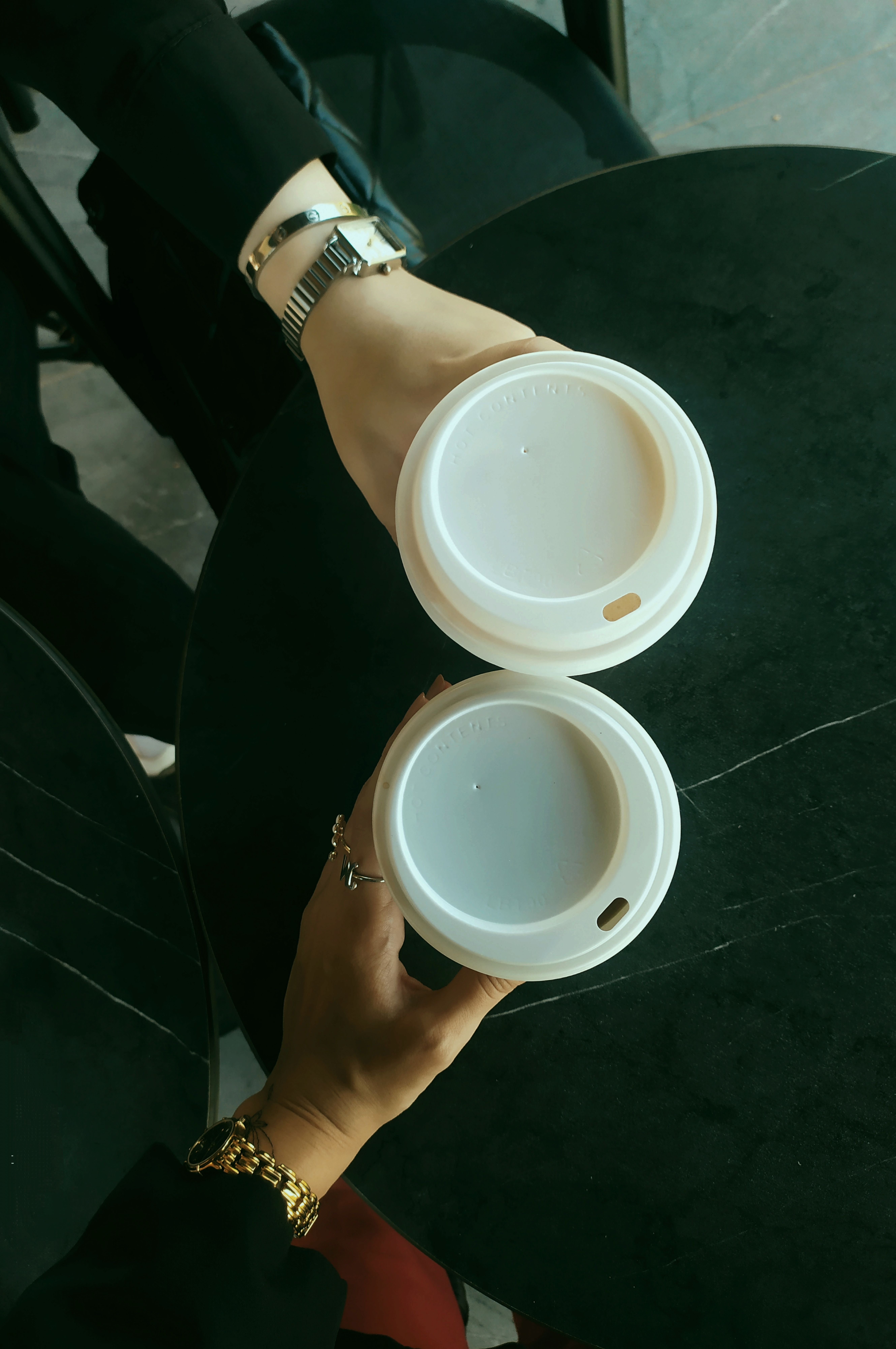Close-up of Two People Holding Coffee Cups · Free Stock Photo