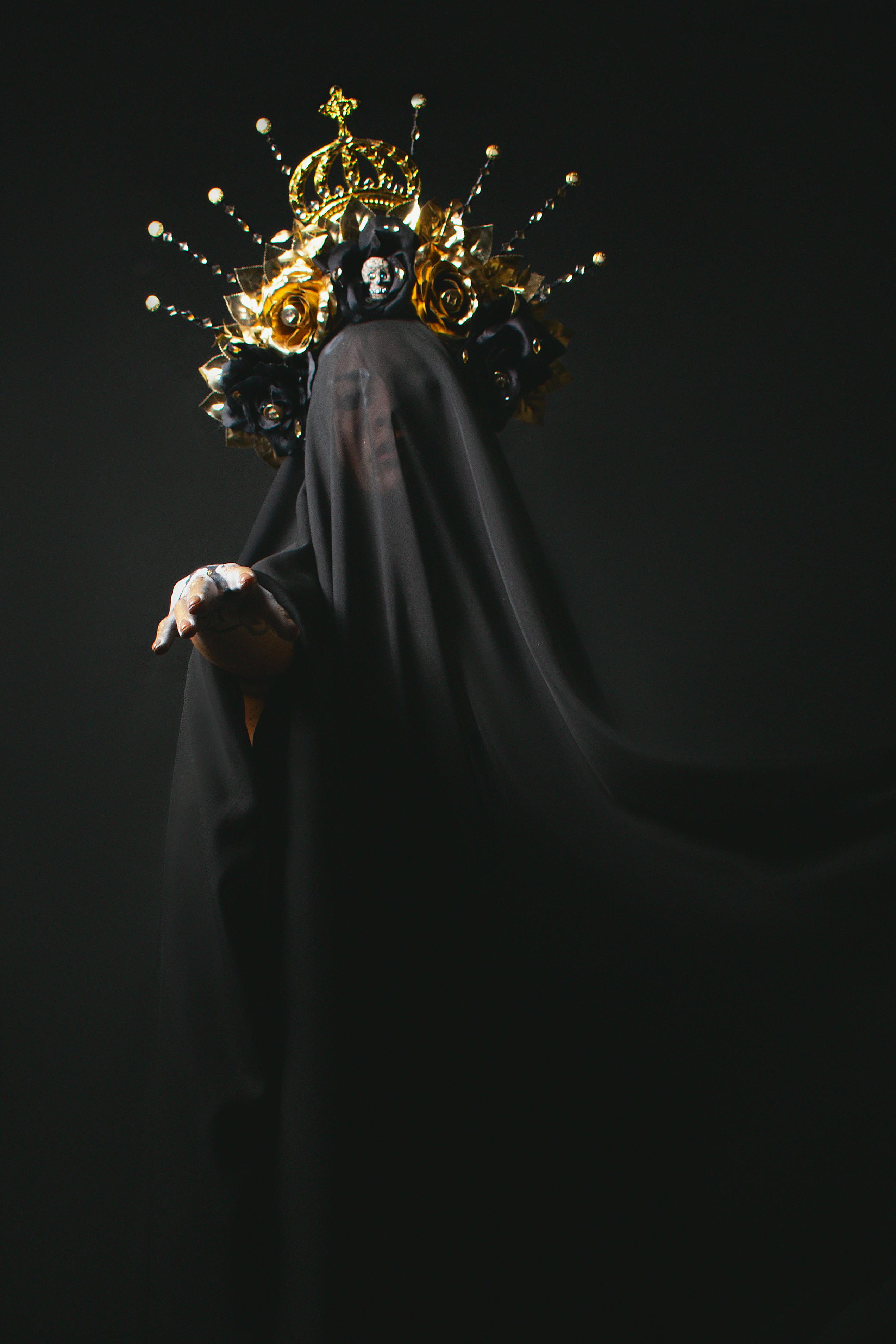 Dramatic Veiled Figure with Ornate Headdress · Free Stock Photo