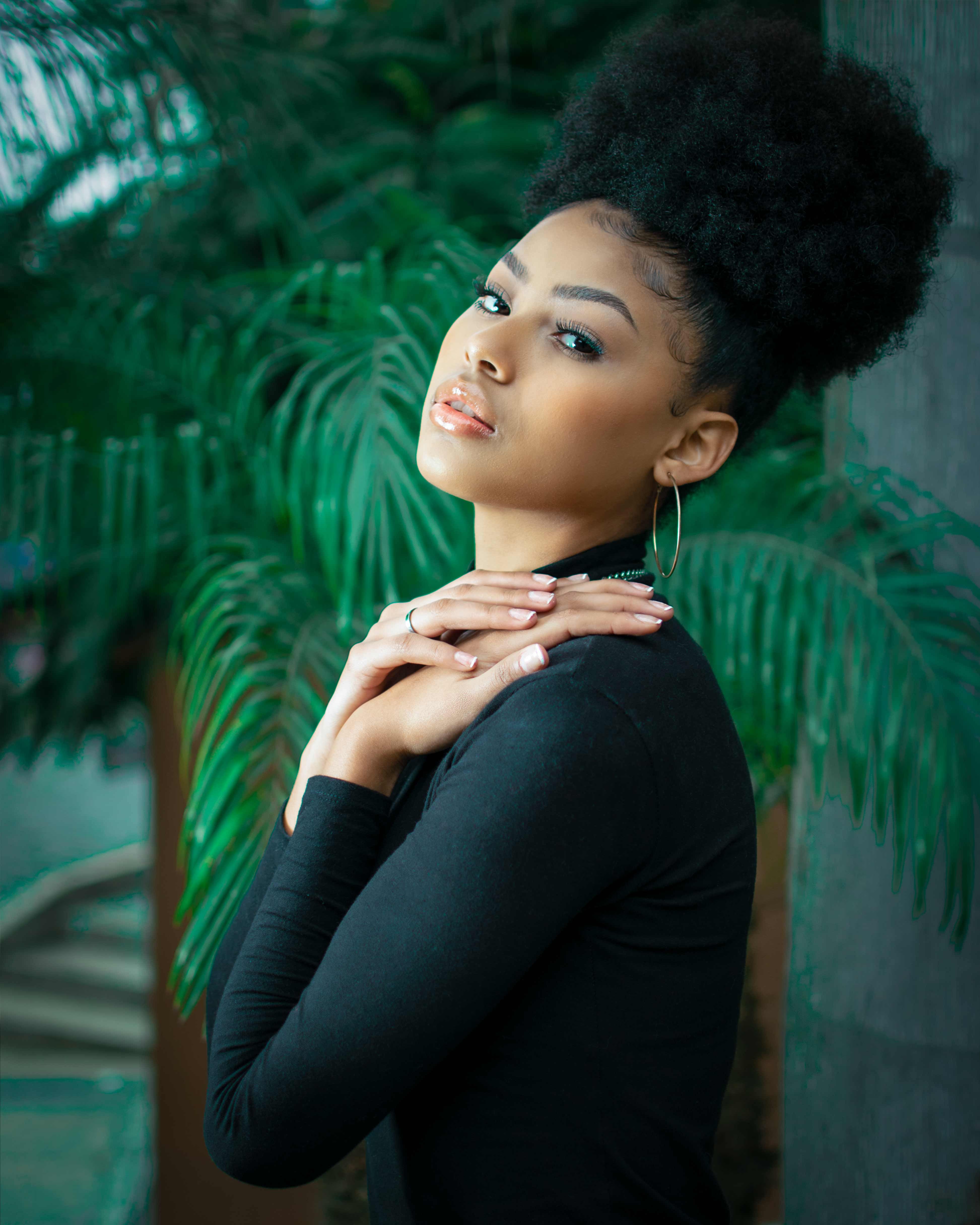 Elegant Portrait of a Woman with Natural Hair · Free Stock Photo