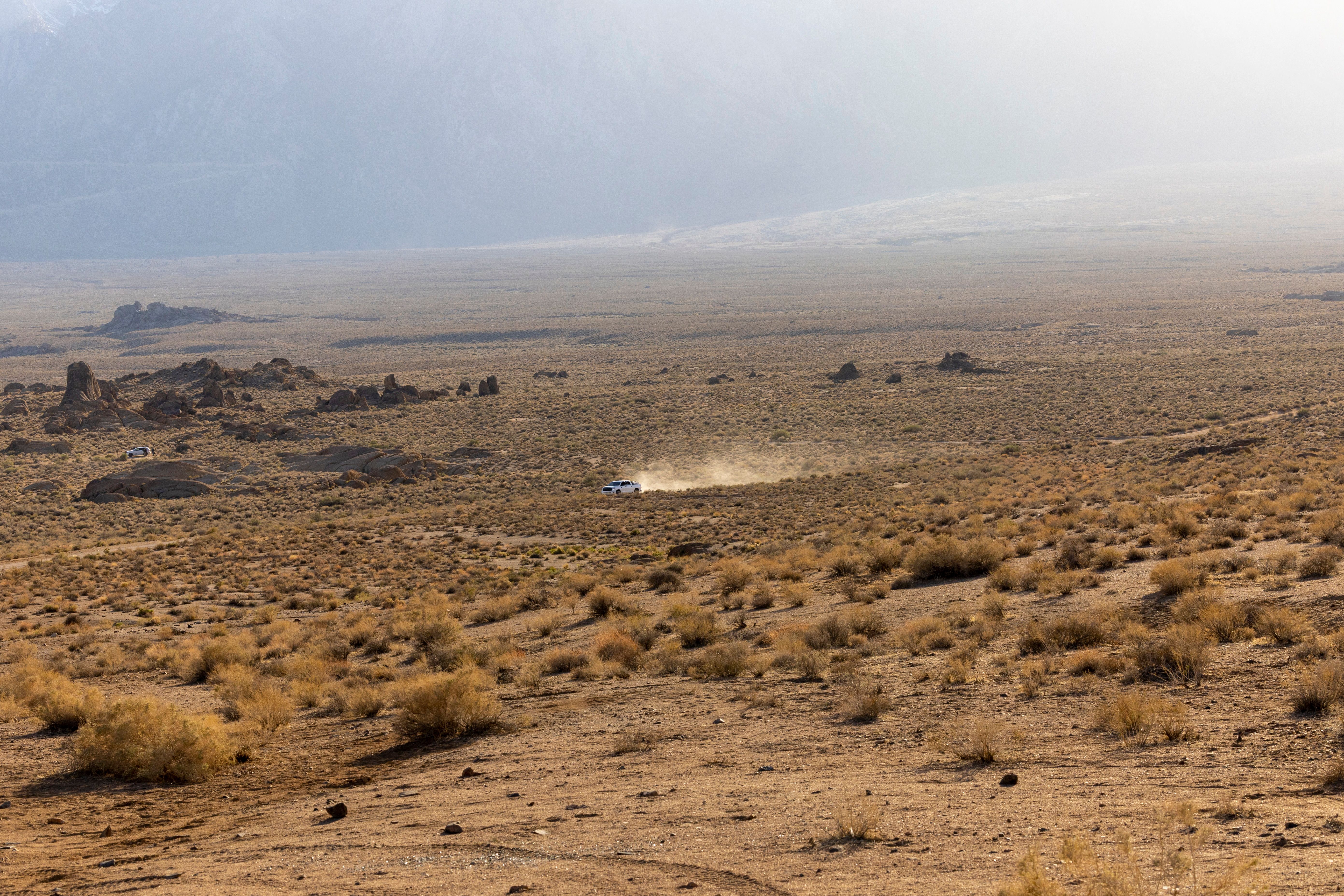 Dramatic Desert Landscape with Off-Road Vehicle · Free Stock Photo