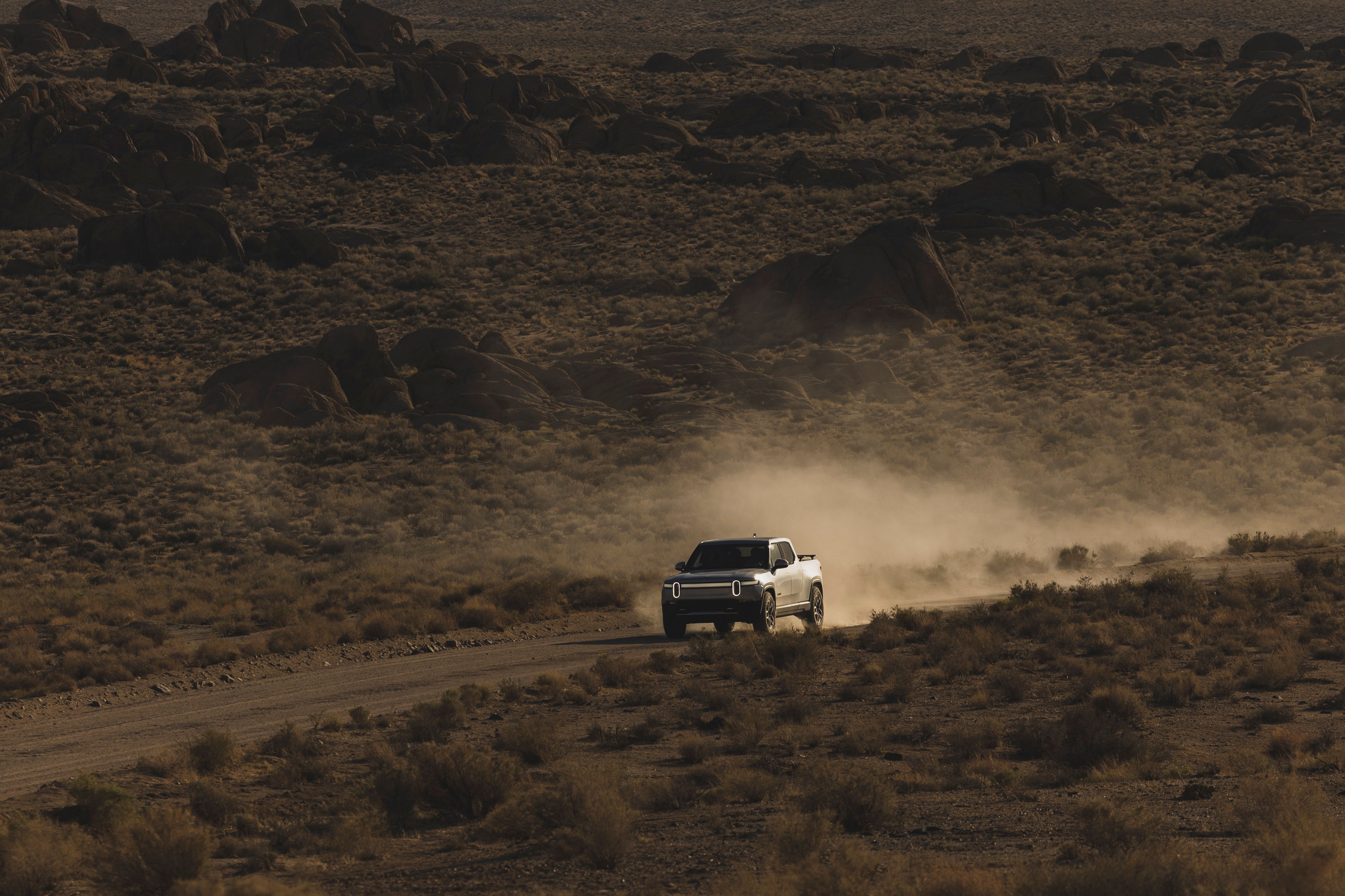 Off-Road Truck Driving Through Desert Landscape · Free Stock Photo