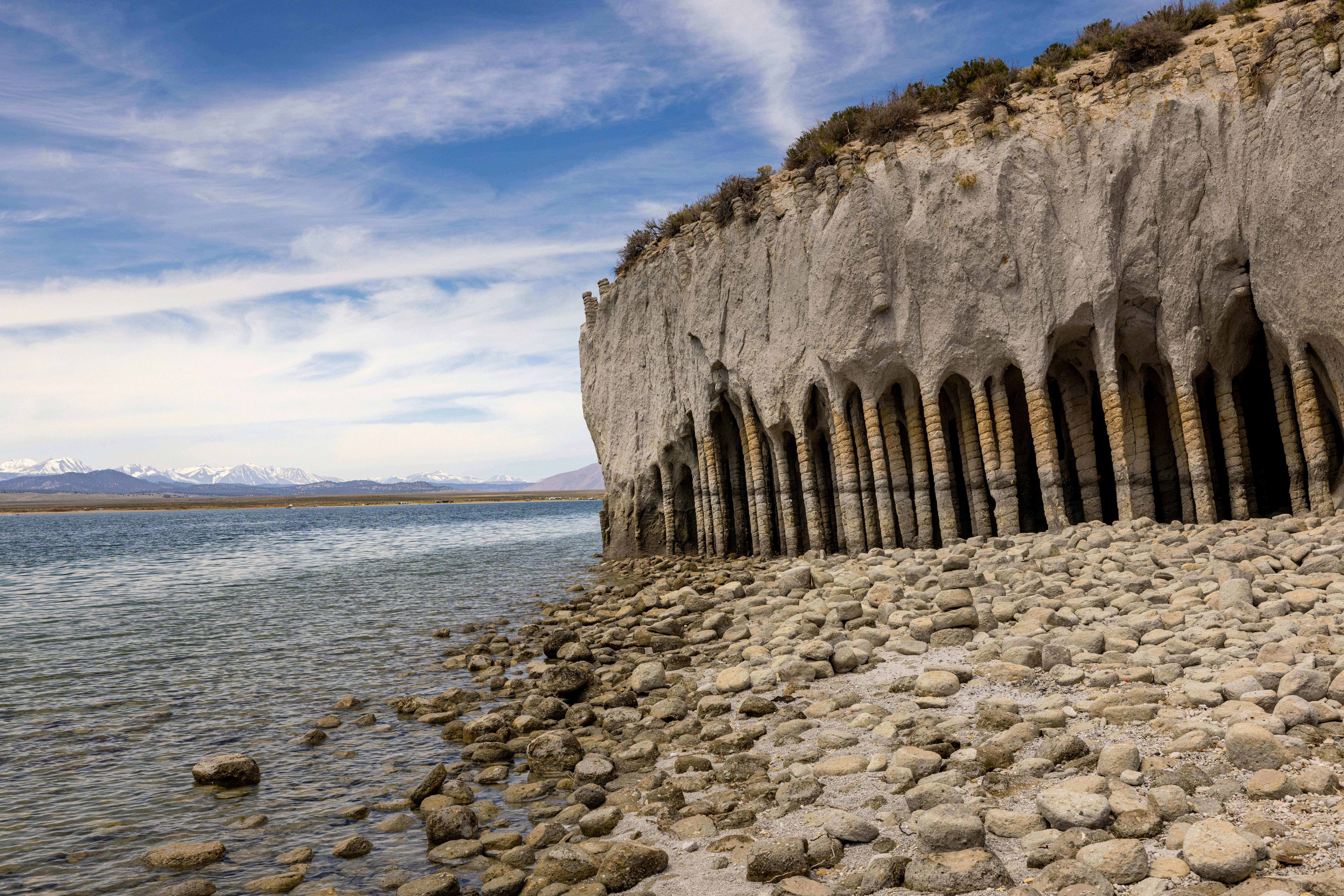 Scenic Basalt Columns by Tranquil Lake Shore · Free Stock Photo