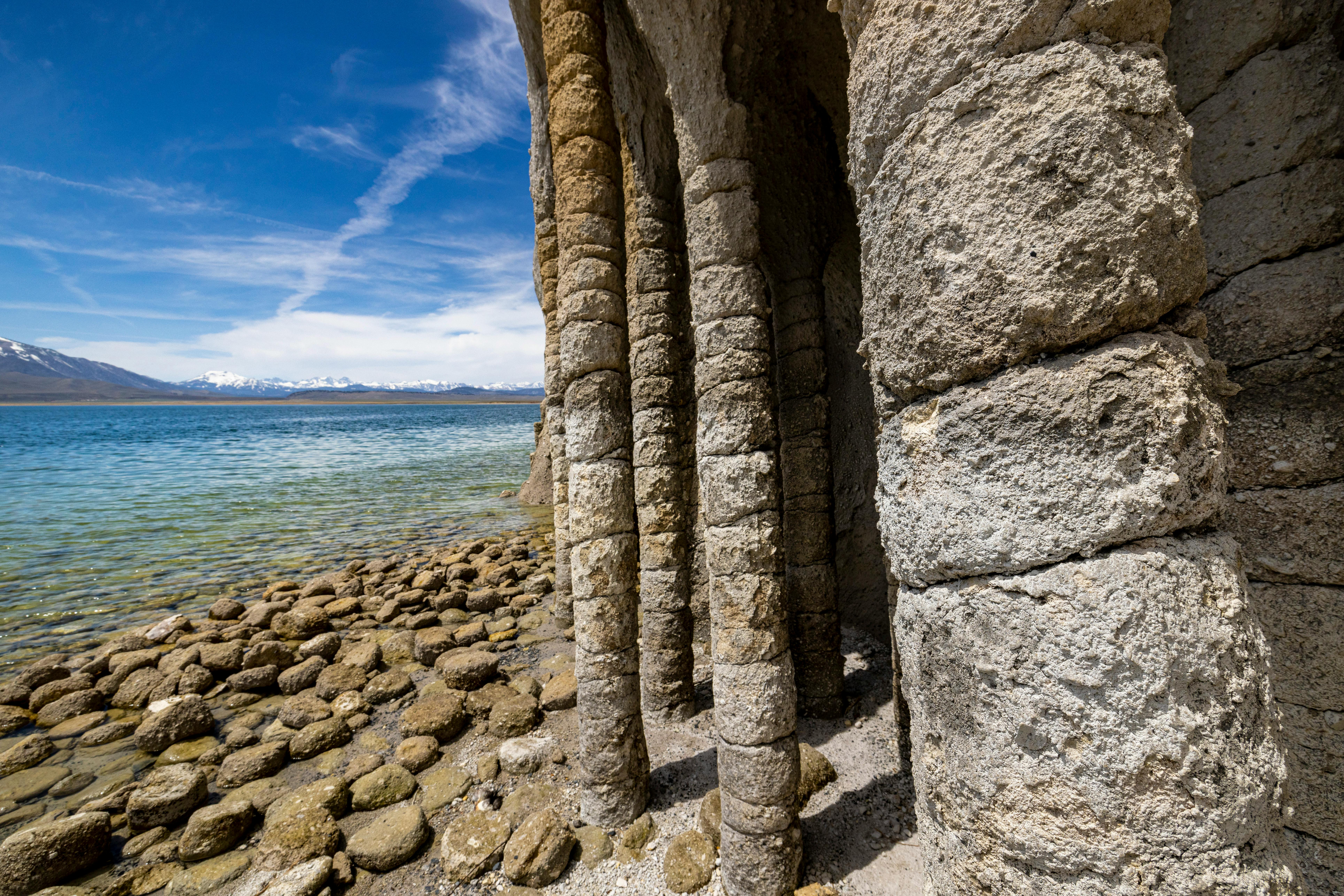 Scenic Rock Formations by Serene Lakeside · Free Stock Photo