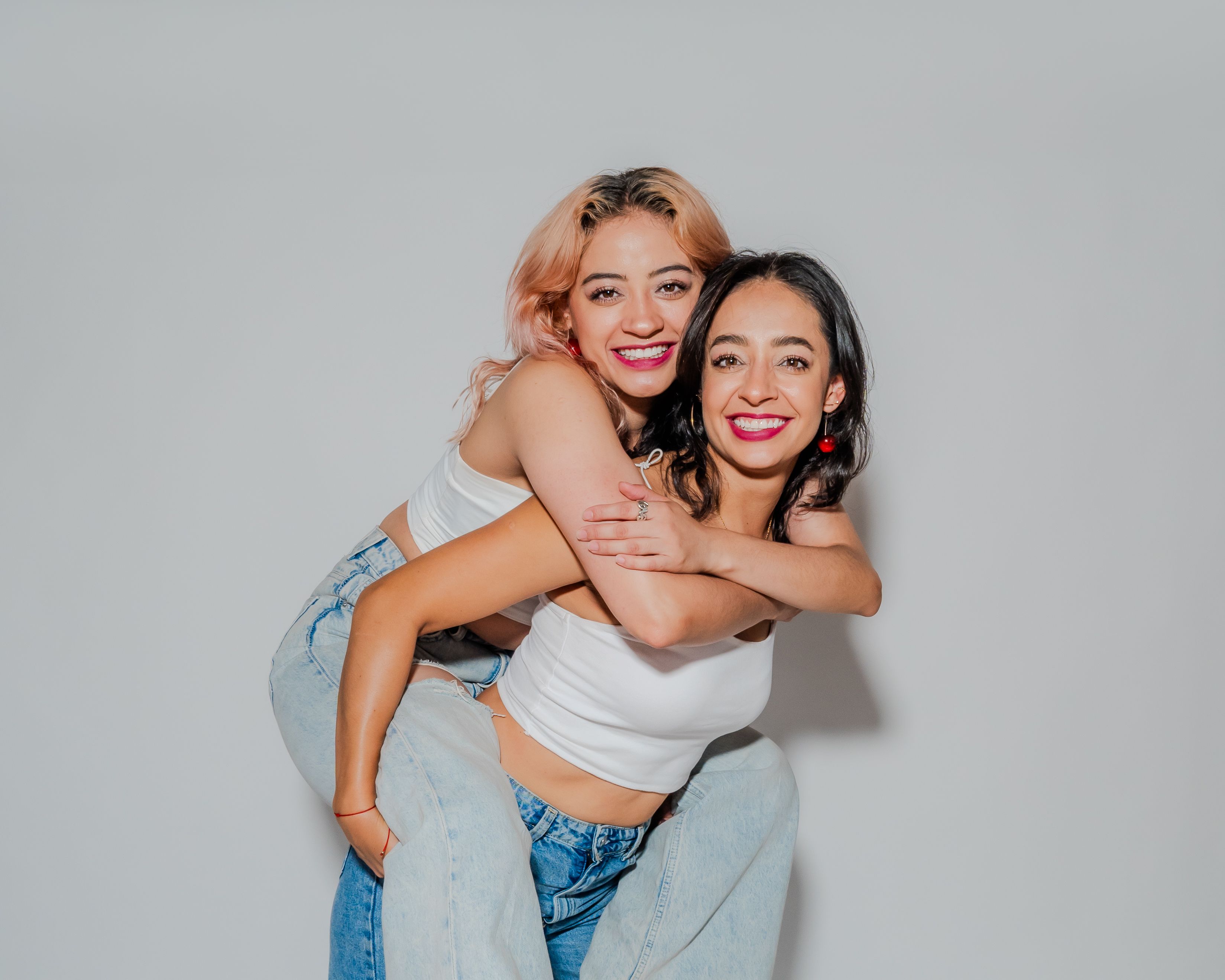 Joyful Portrait of Young Friends Embracing · Free Stock Photo