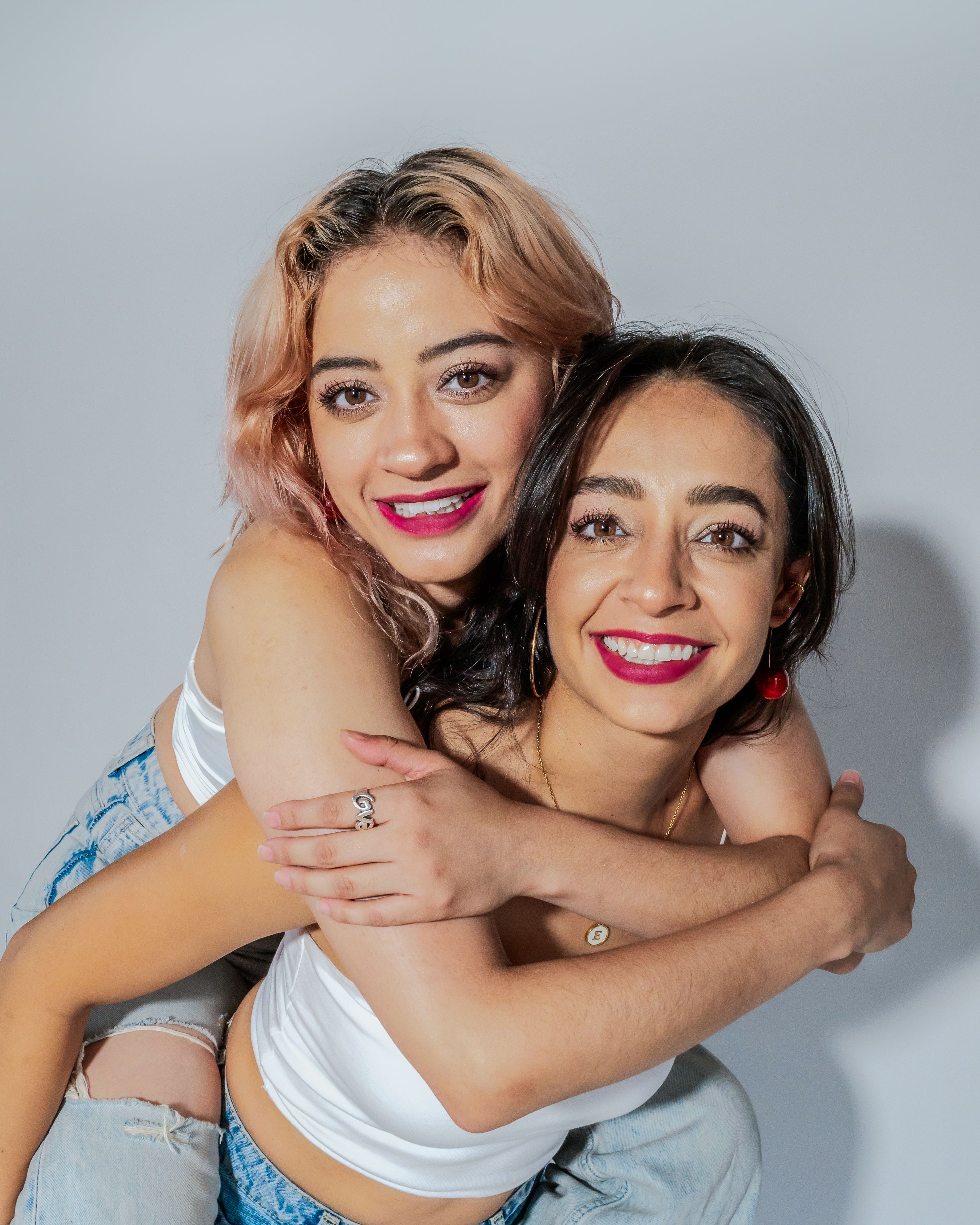 Joyful Female Friendship Embracing Portrait · Free Stock Photo