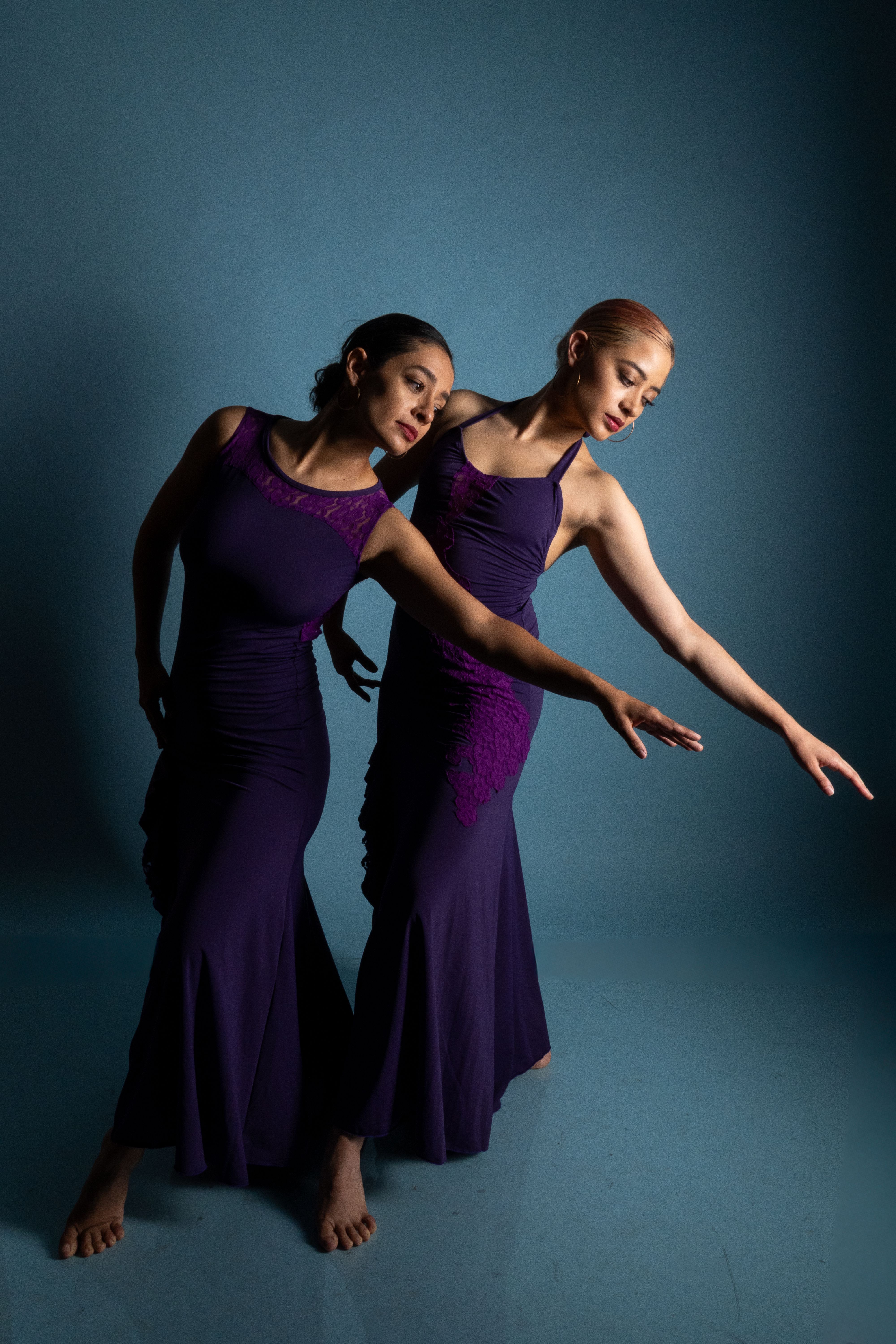Elegant Flamenco Dance Duo in Purple Dresses · Free Stock Photo