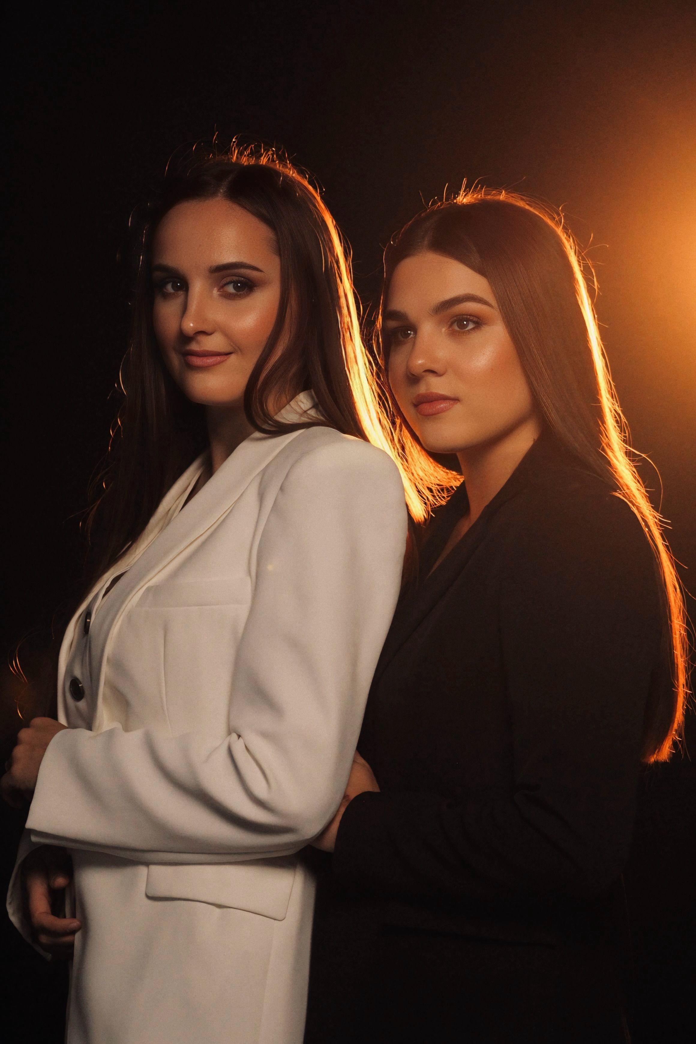 Elegant Portrait of Two Women in Dramatic Lighting · Free Stock Photo