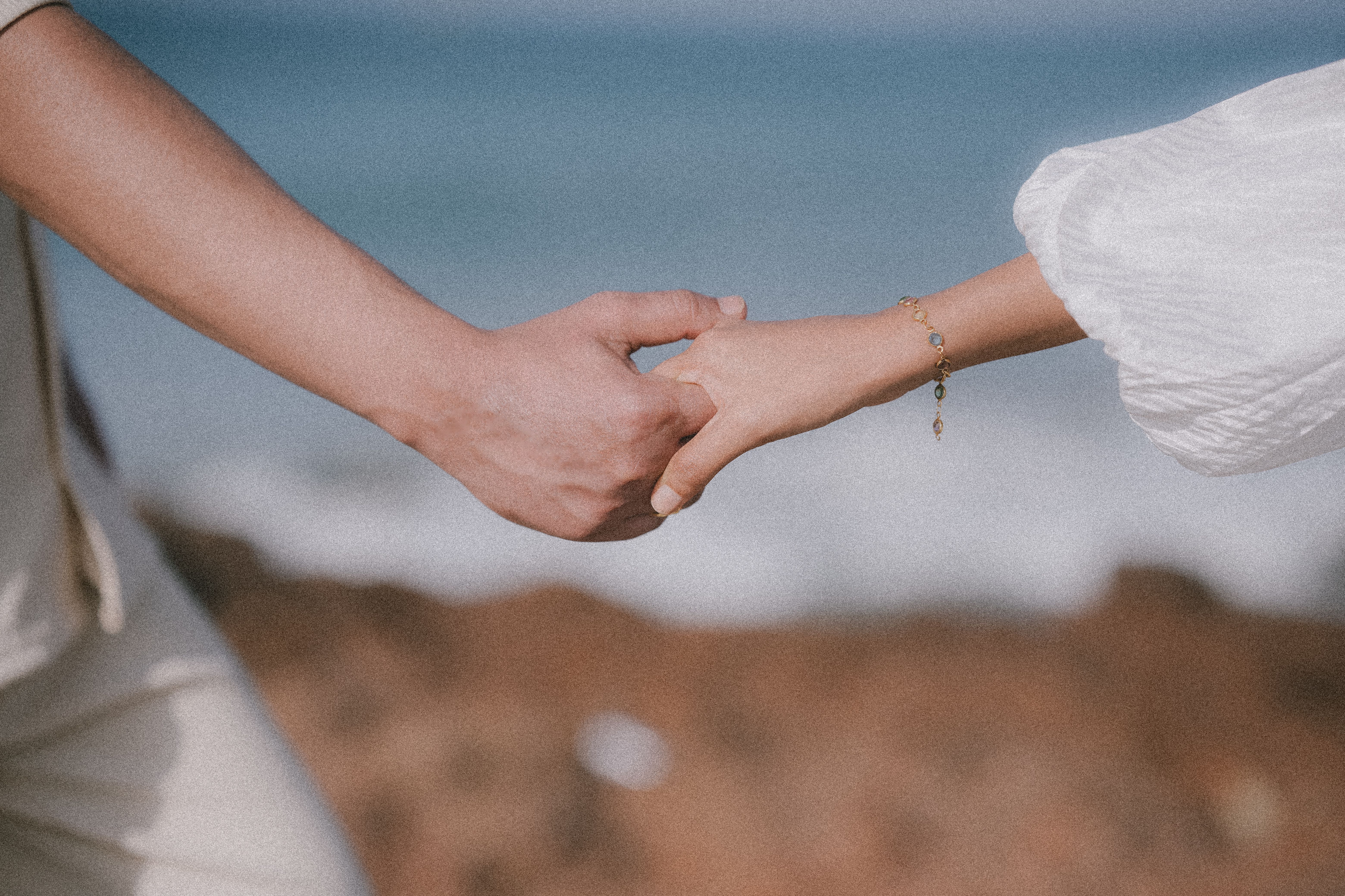 Romantic Beach Engagement Holding Hands · Free Stock Photo