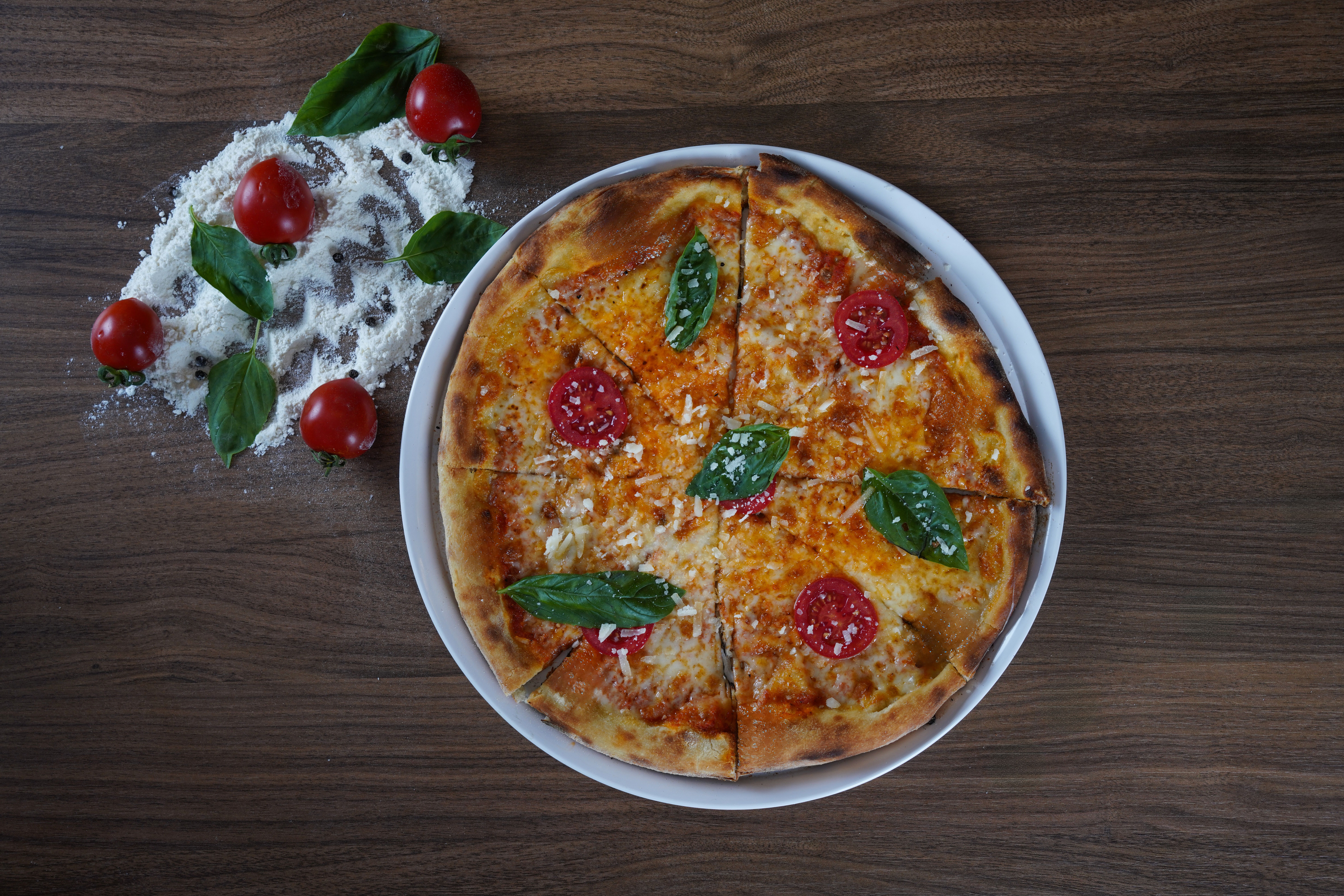 Gourmet Homemade Pizza with Fresh Basil and Tomato · Free Stock Photo