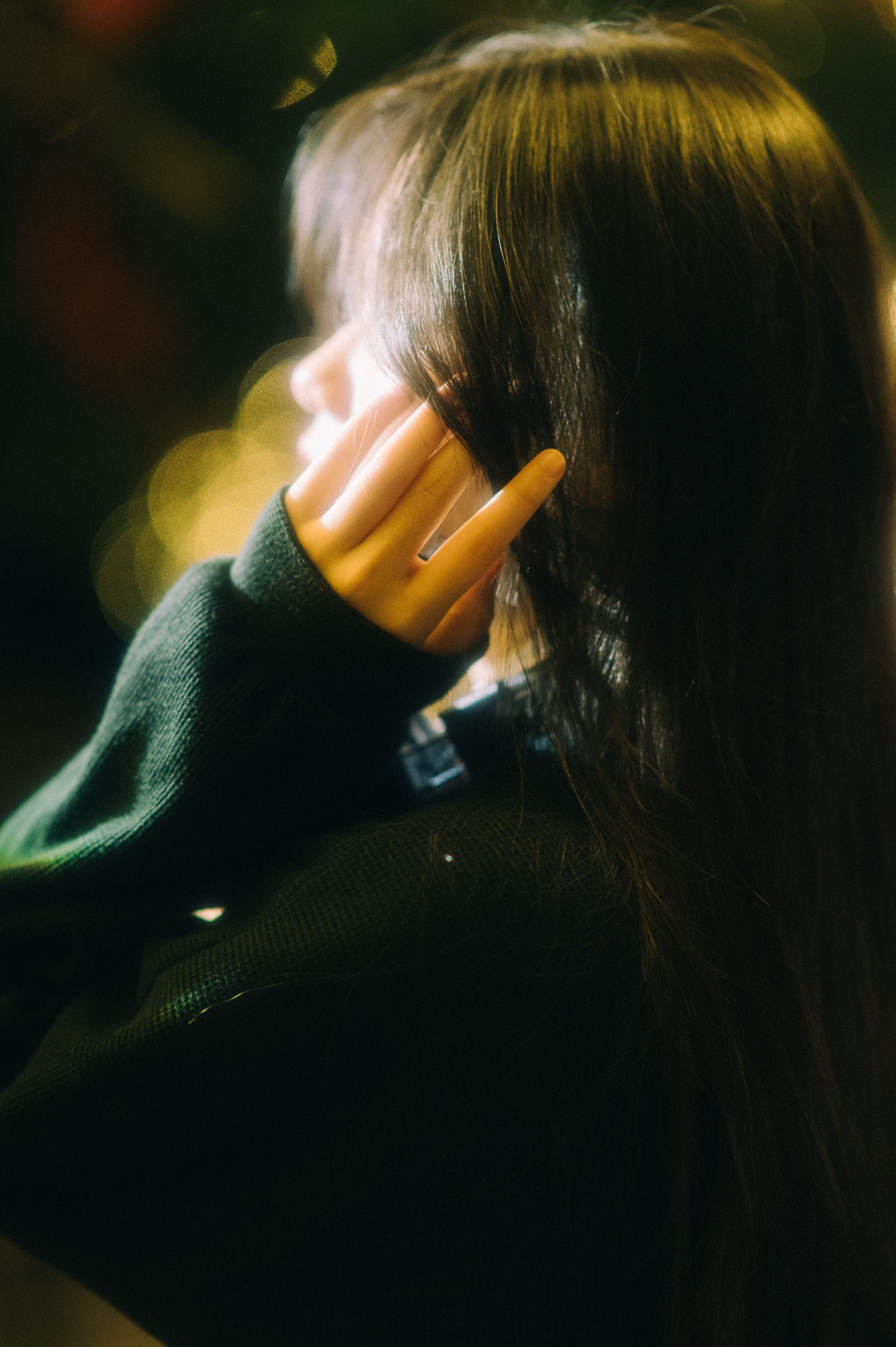 Moody Portrait of a Woman with Backlit Hair · Free Stock Photo