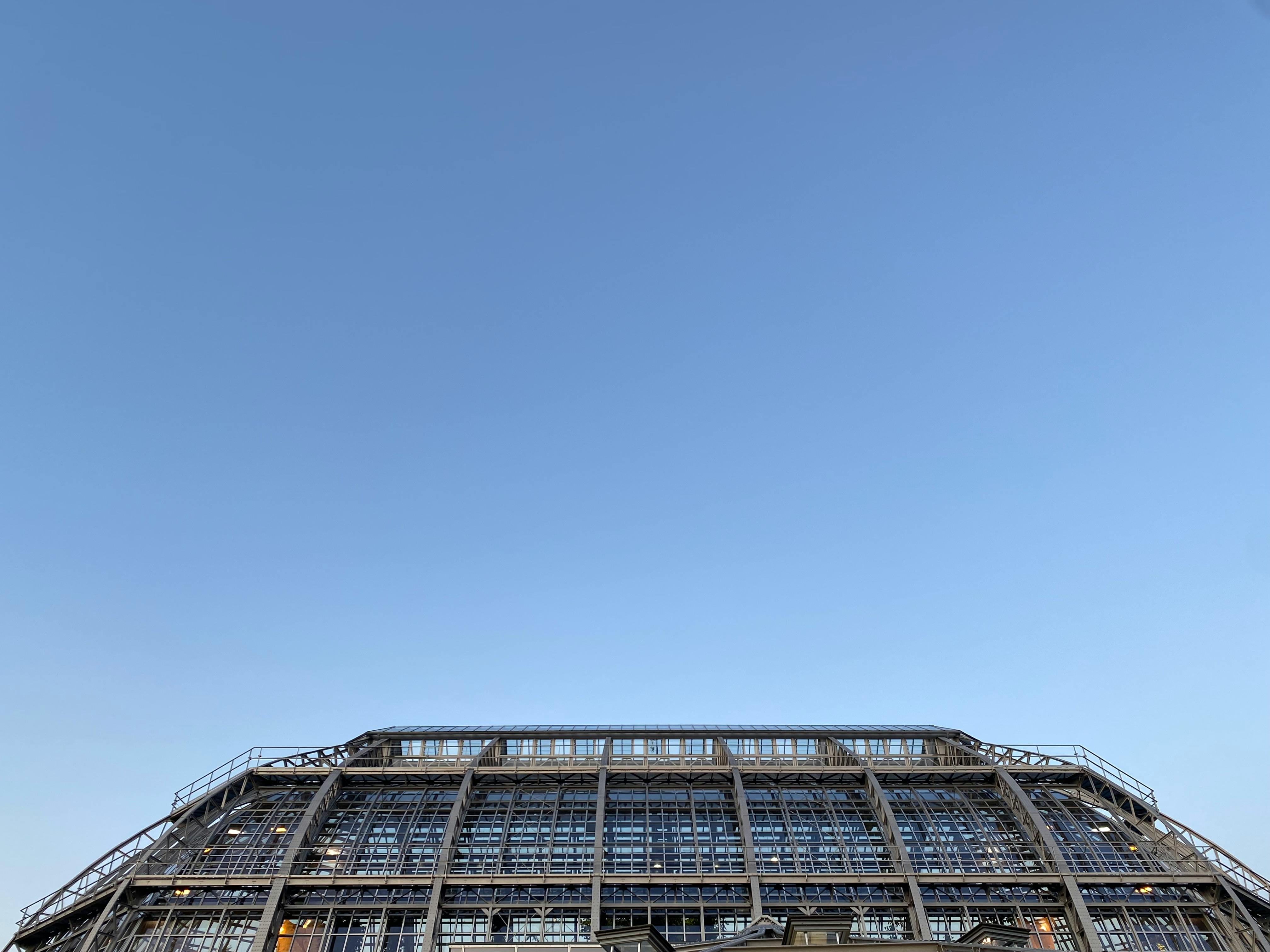 Modern Architectural Structure Against Clear Sky · Free Stock Photo