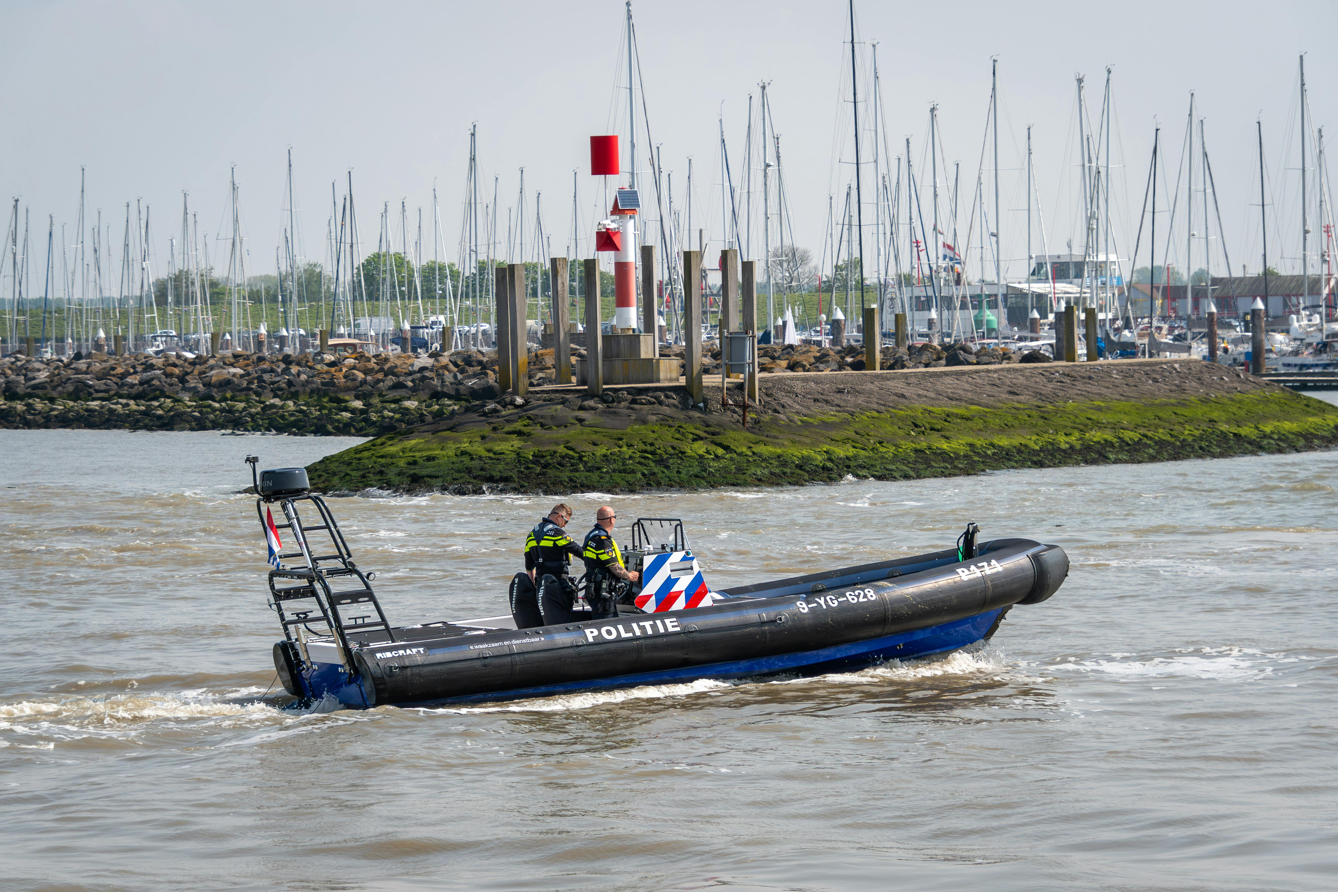 Police Boat Patrolling Marina Waters · Free Stock Photo