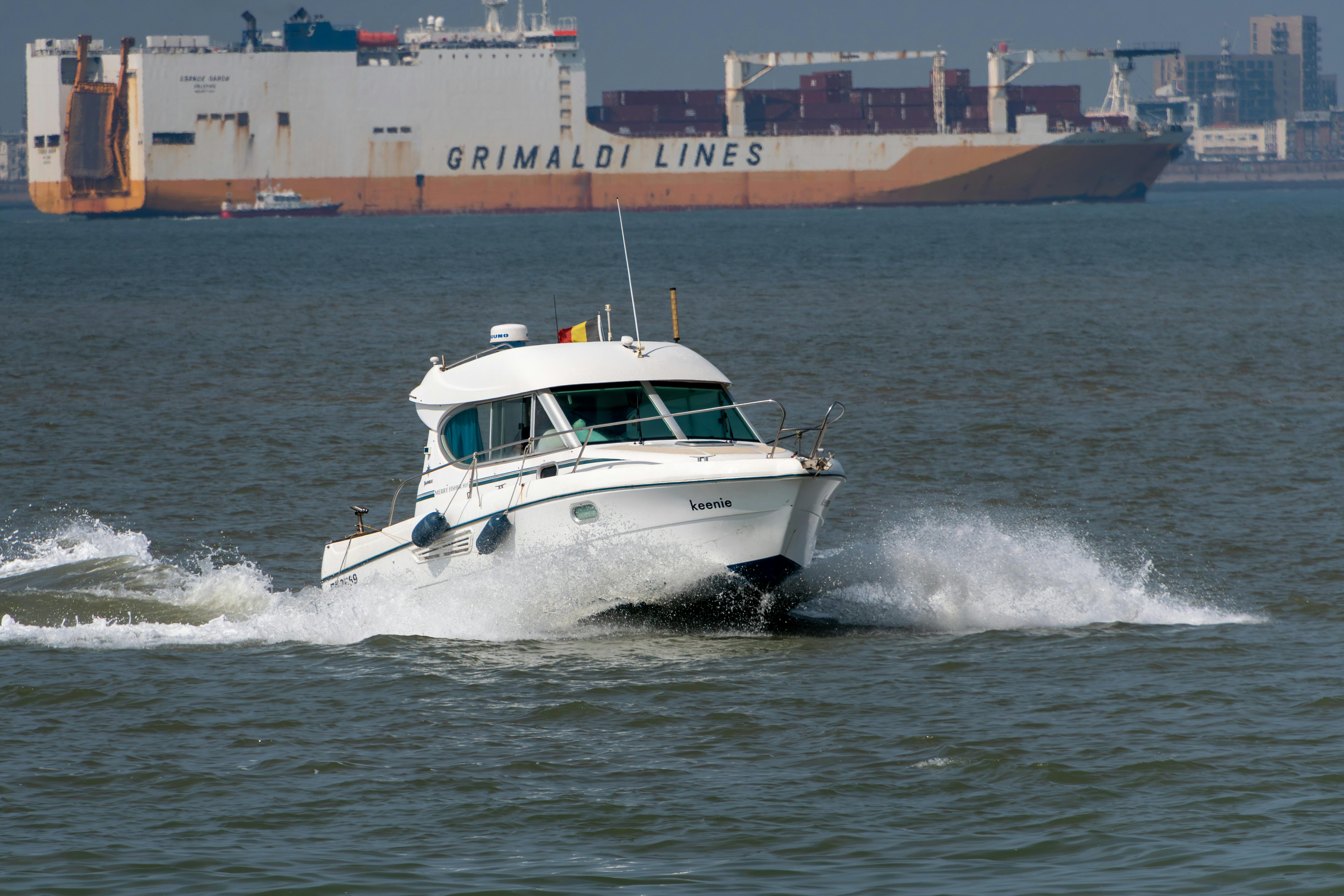 Boat floating in open sea · Free Stock Photo