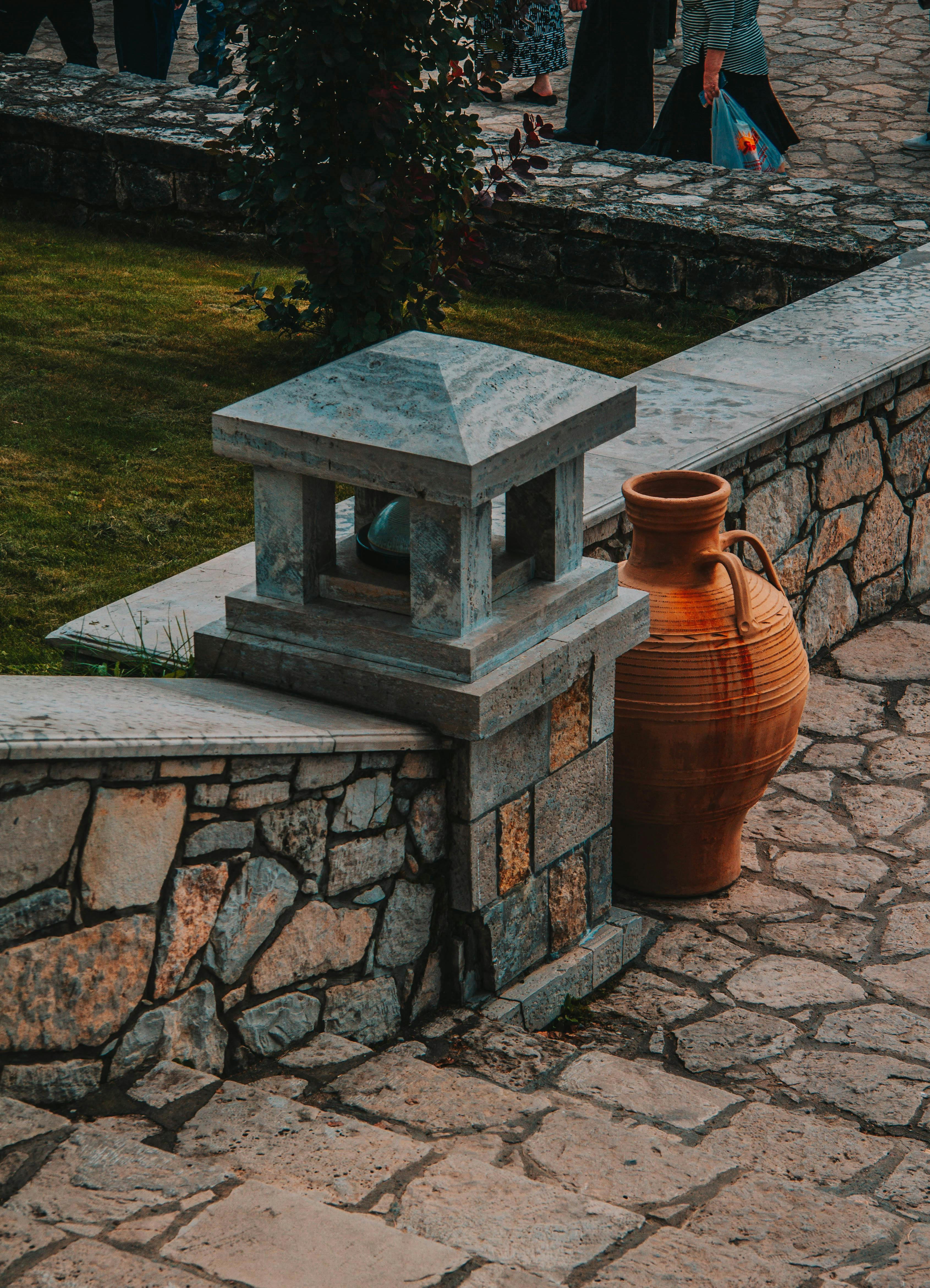 Stone Pathway with Rustic Clay Pot and Lantern · Free Stock Photo