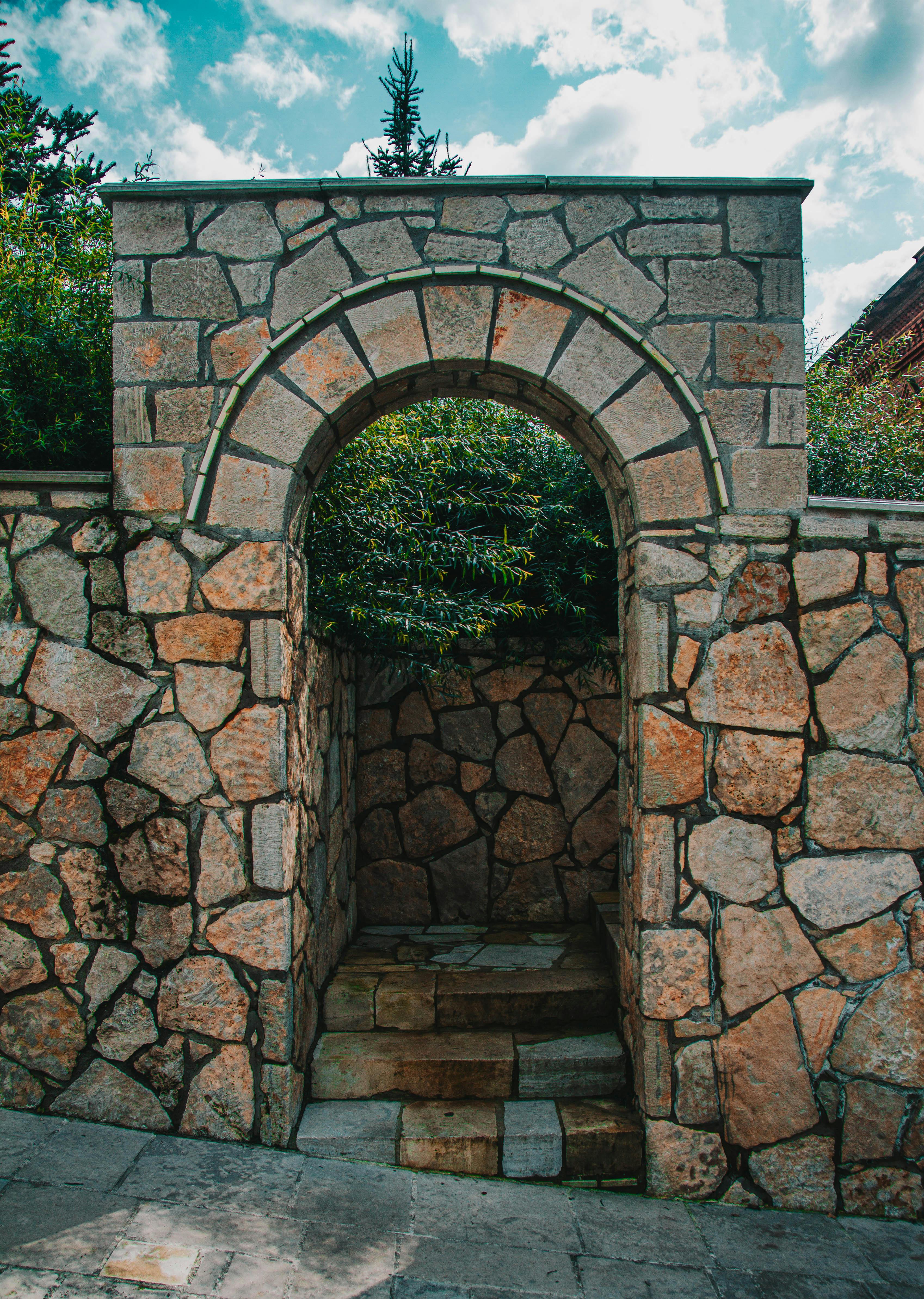 Stone Archway in Historic Setting Outdoors · Free Stock Photo