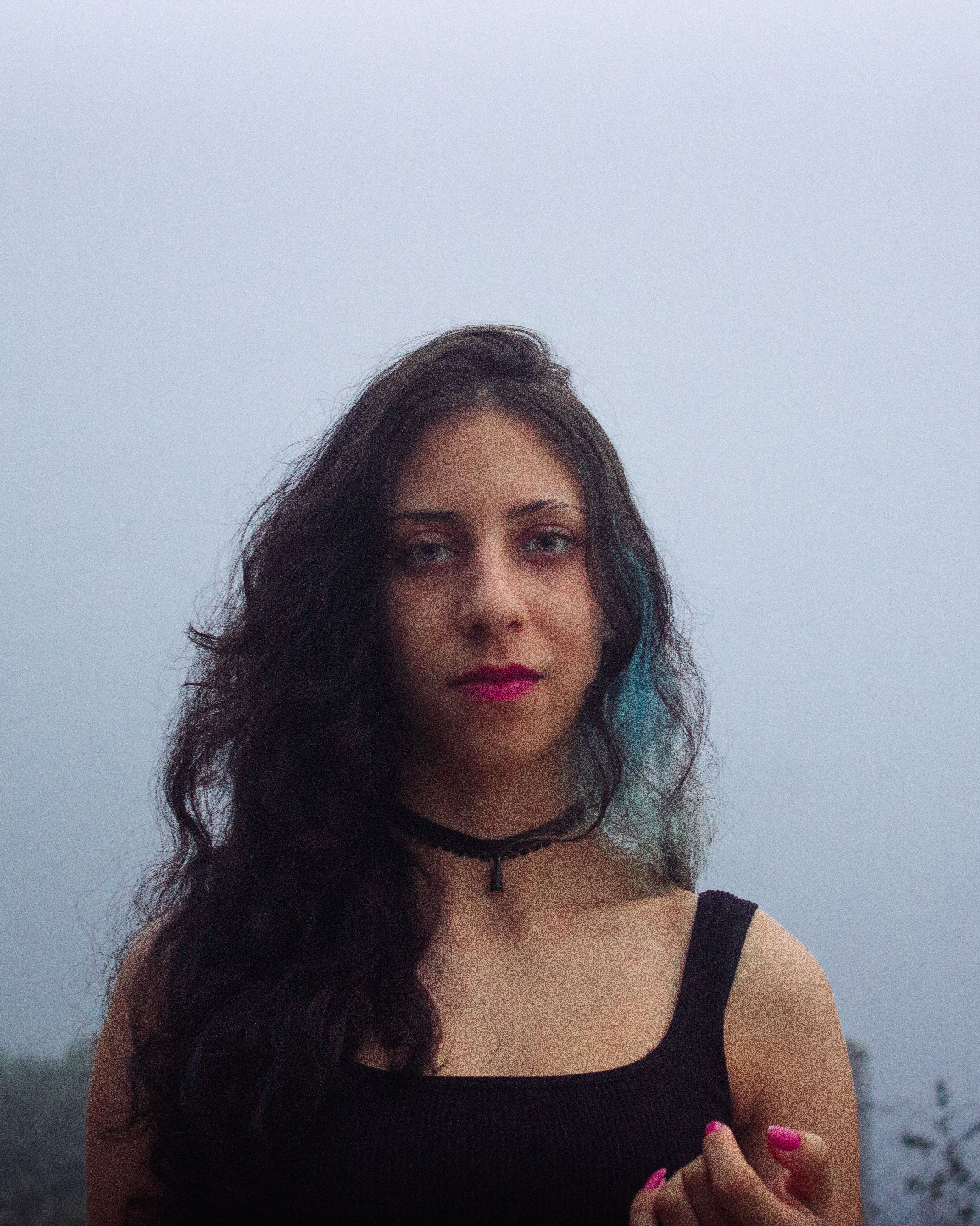 Portrait of Woman in Misty Outdoor Setting · Free Stock Photo