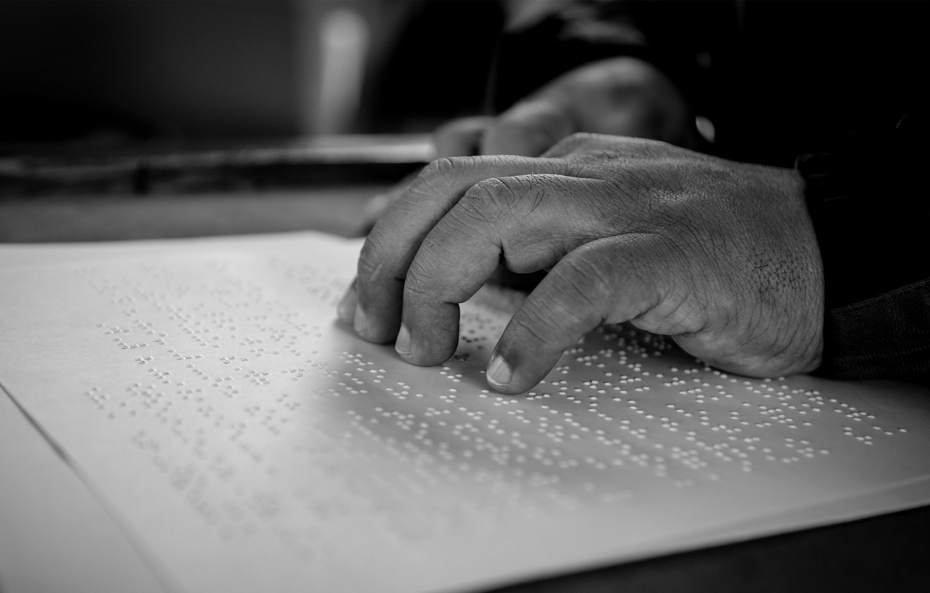 Hands Reading Braille: Empowering Accessibility · Free Stock Photo