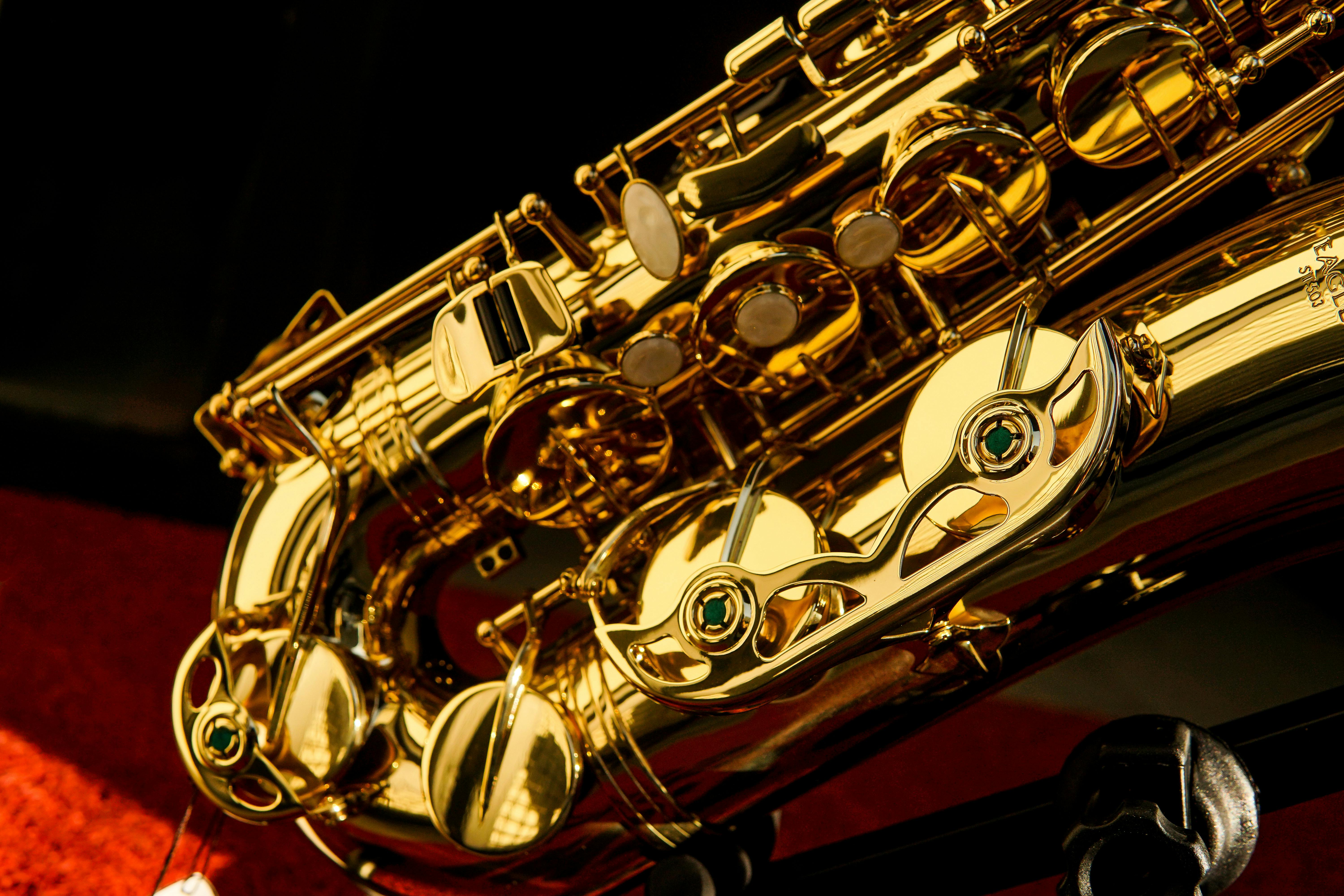 Close-up of a Shiny Gold Saxophone Instrument · Free Stock Photo