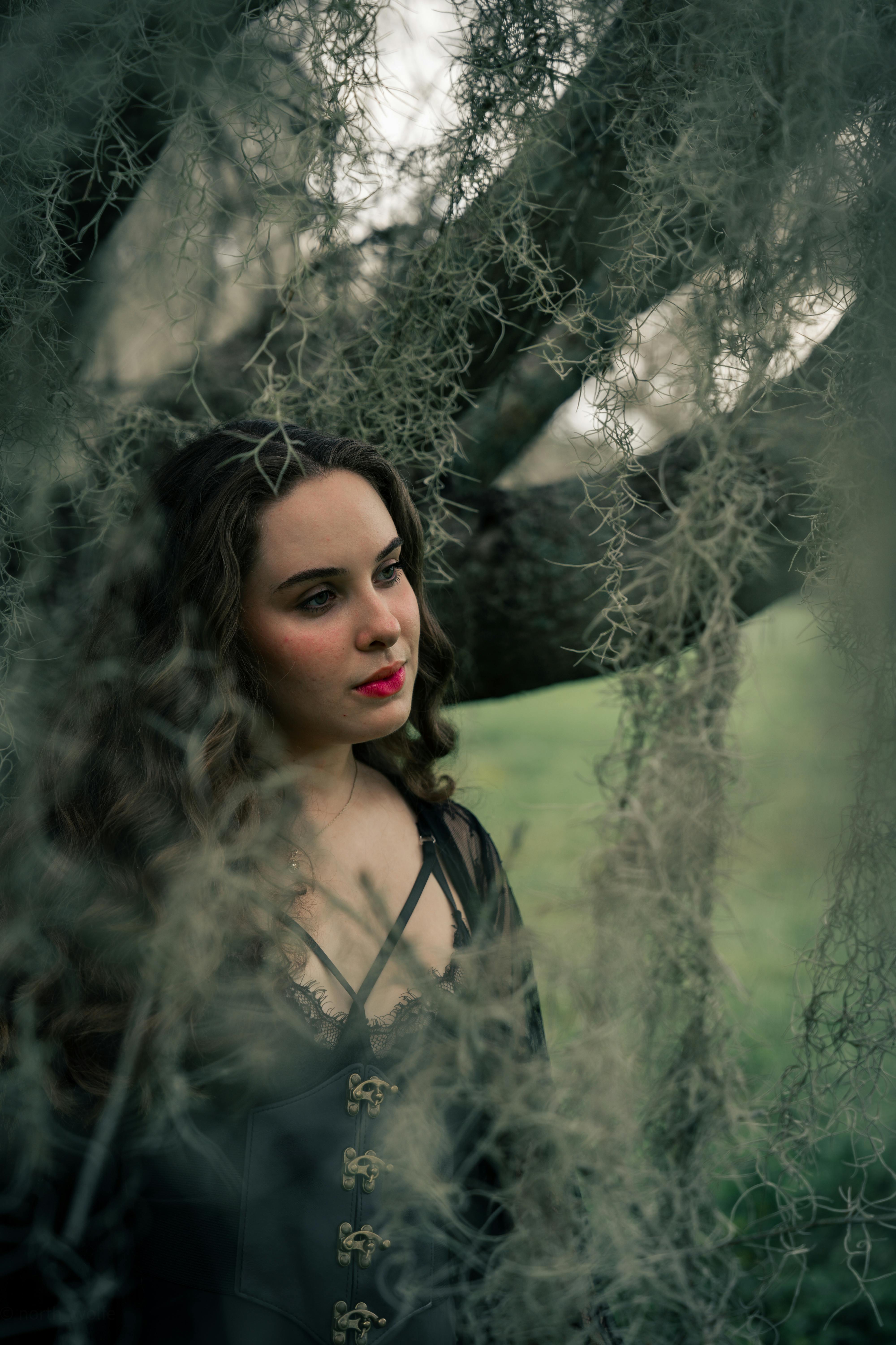 A Woman Sitting on the Tree Log · Free Stock Photo