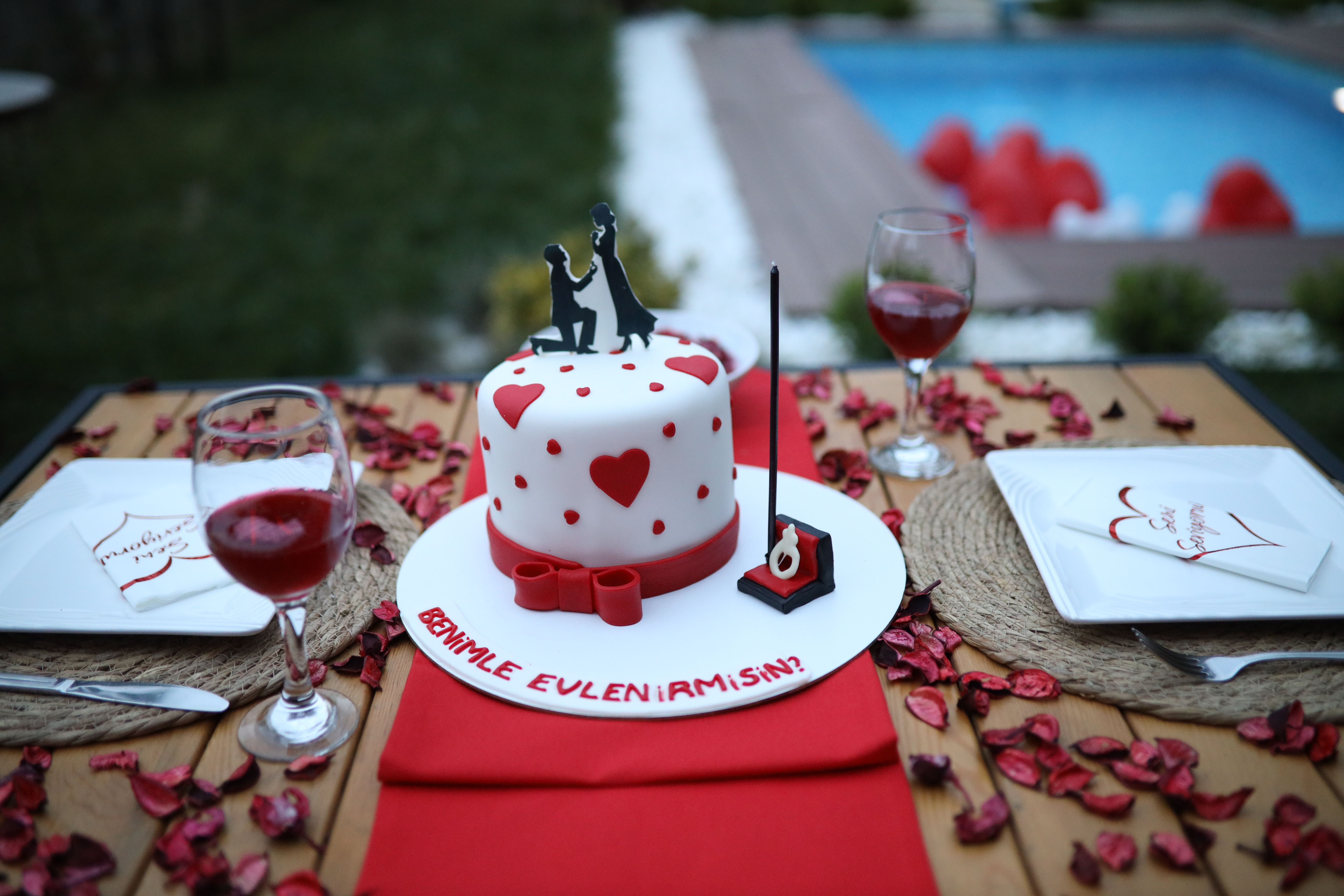 Romantic Proposal Cake by the Poolside · Free Stock Photo