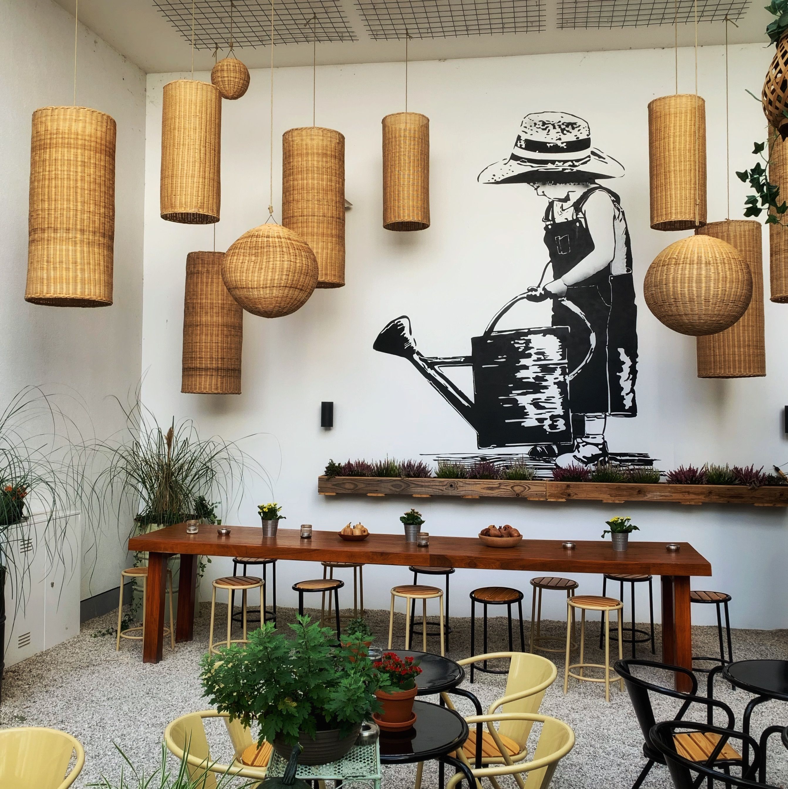 Stylish Indoor Café with Unique Wall Art and Decor · Free Stock Photo