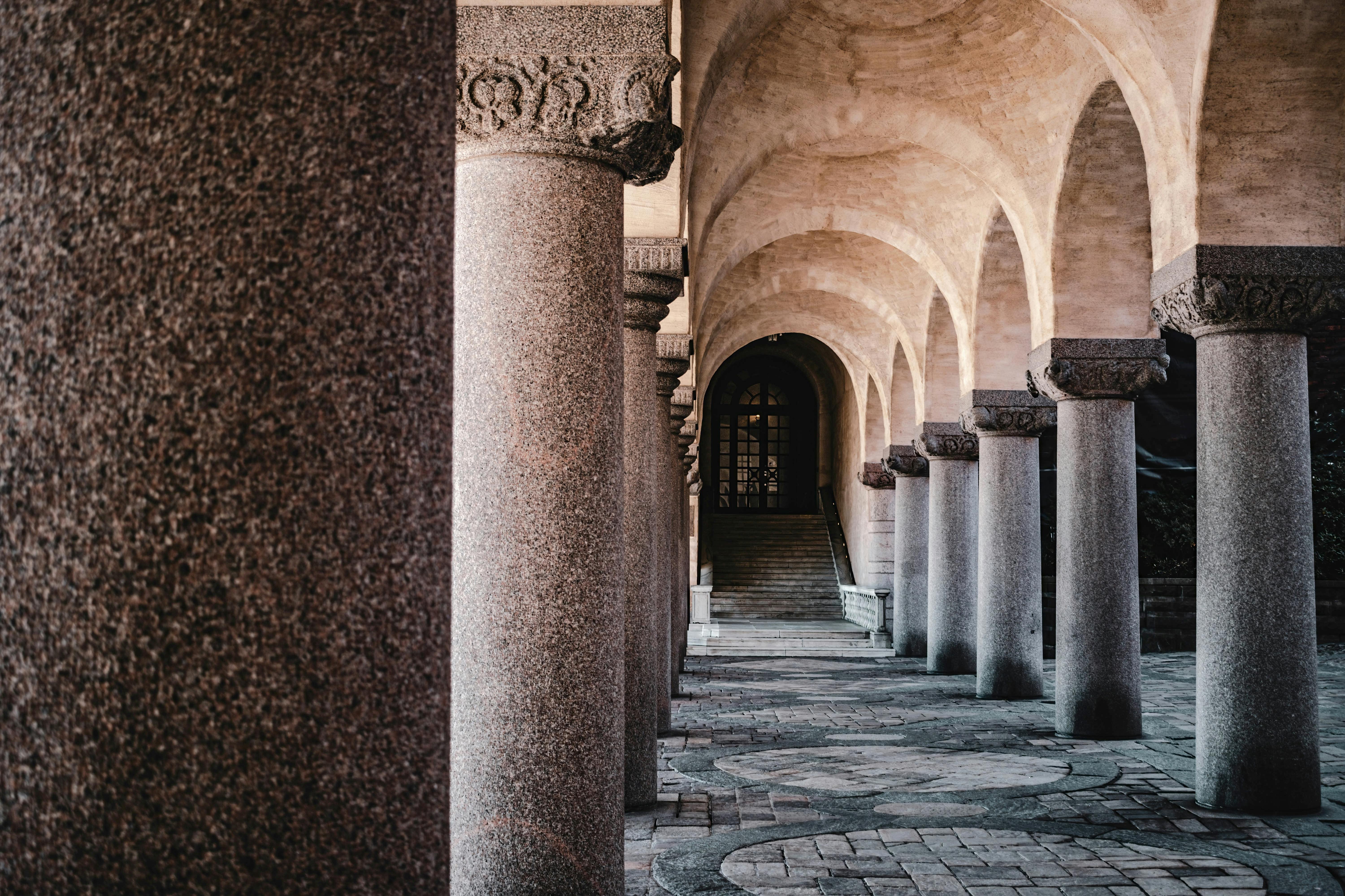 Elegant Stockholm Arched Corridor with Stone Columns · Free Stock Photo