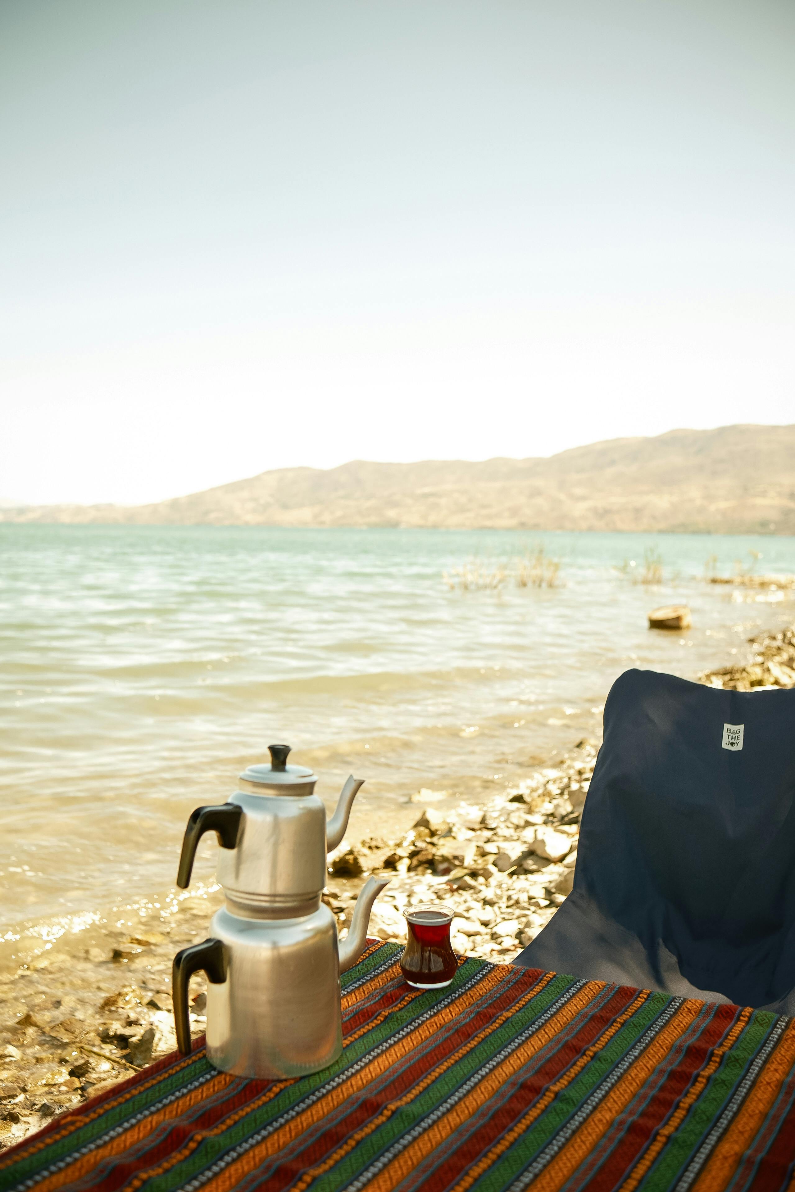 Serene Lakeside Coffee Setup with Scenic View · Free Stock Photo