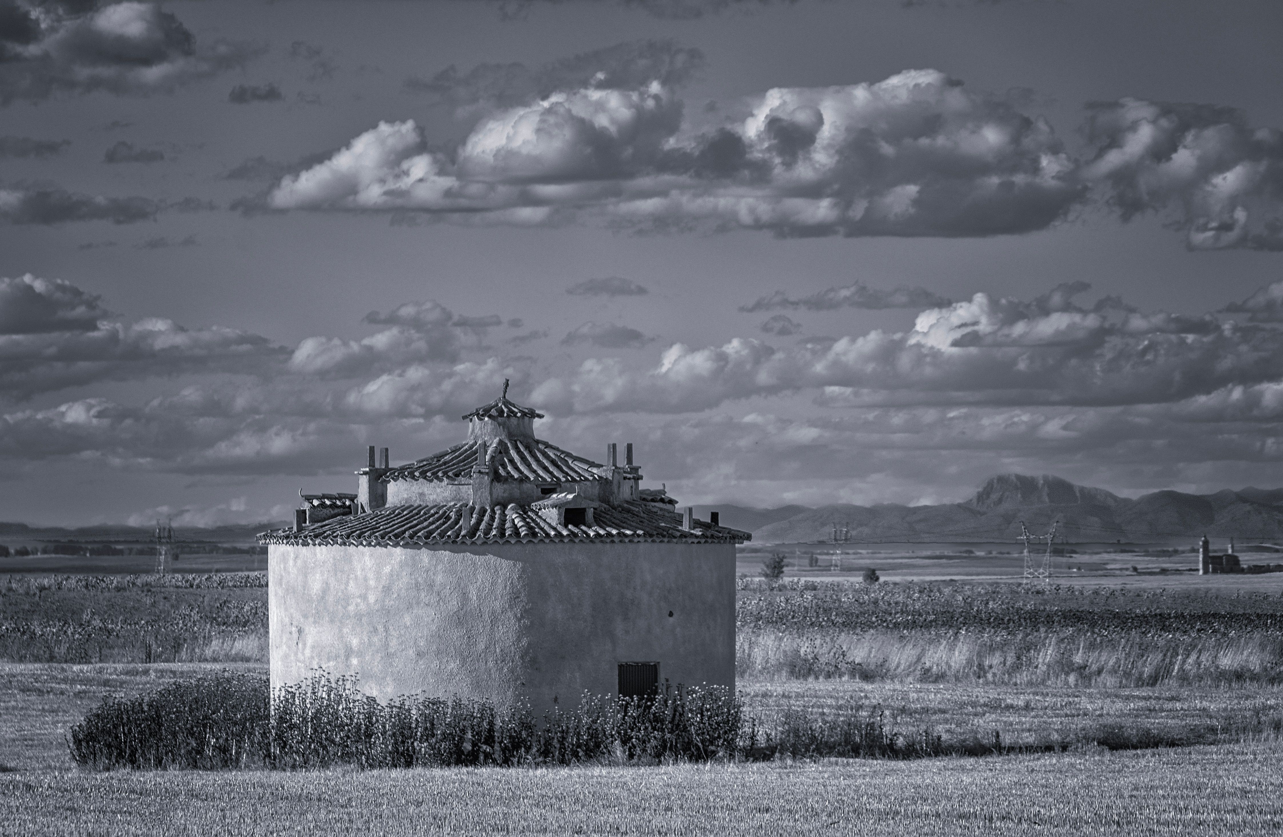 Rustic Rural Building in Vast Open Field · Free Stock Photo