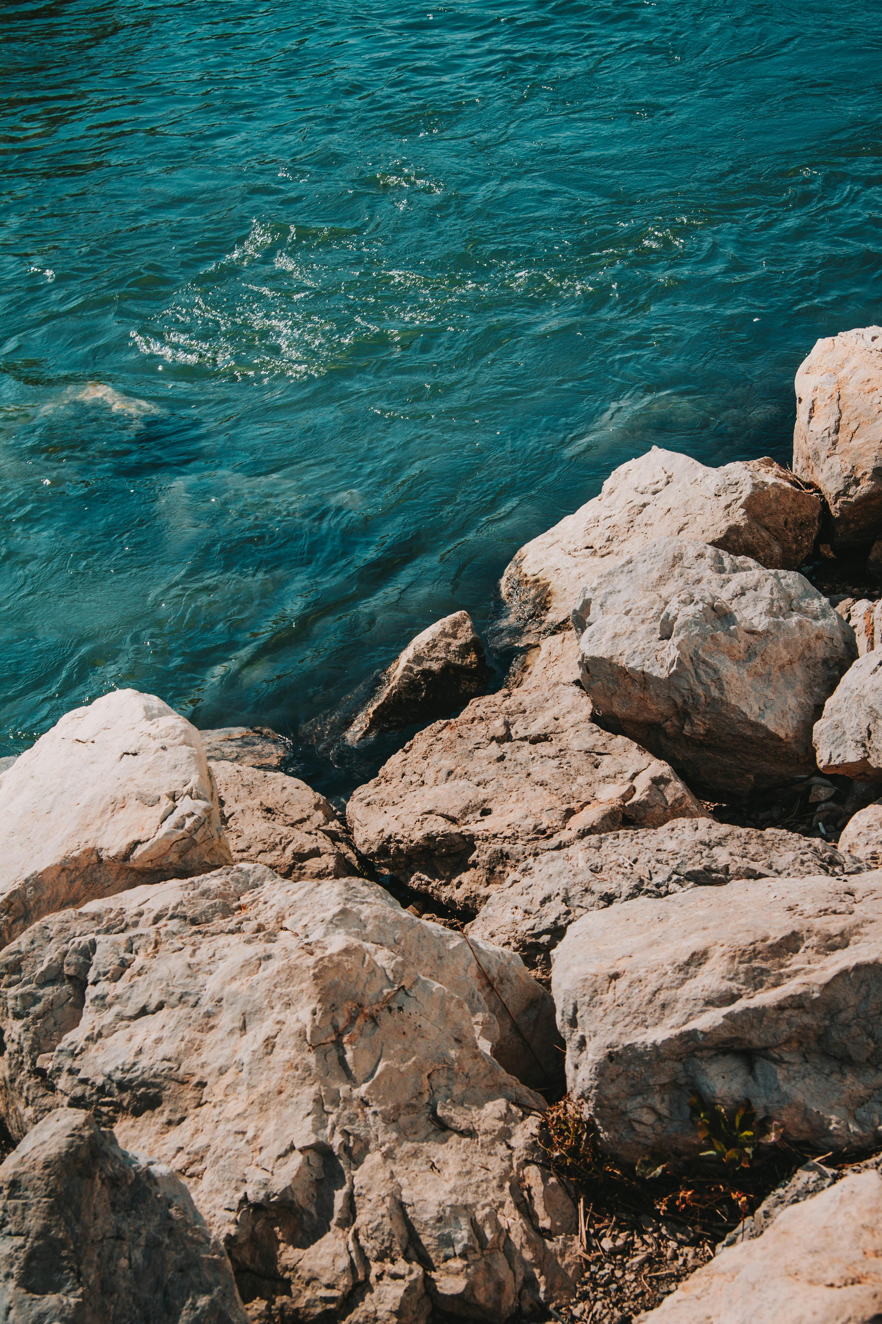 Tranquil Riverbank with Rocks in Bashkortostan · Free Stock Photo