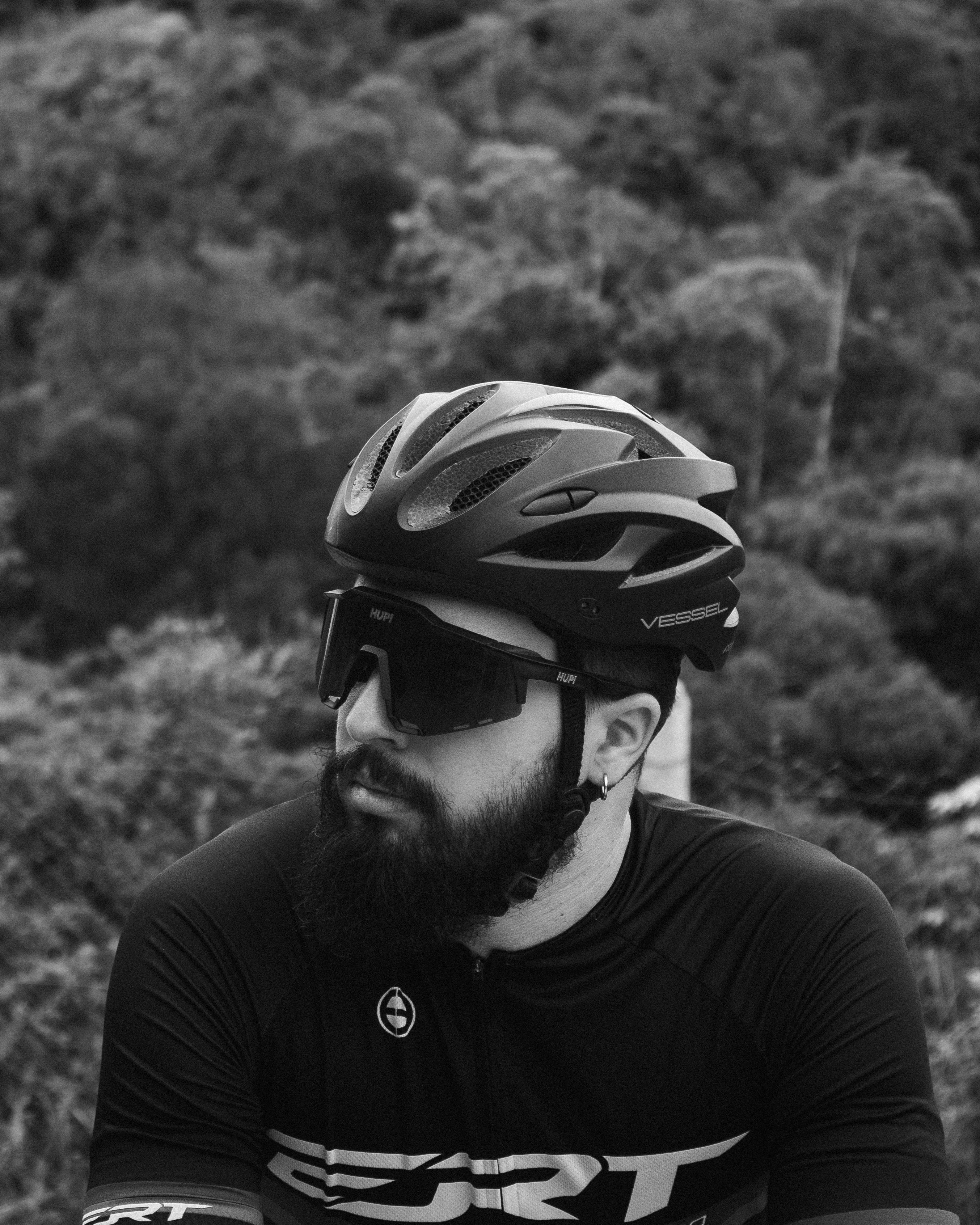 Cyclist in Action with Helmet and Shades · Free Stock Photo